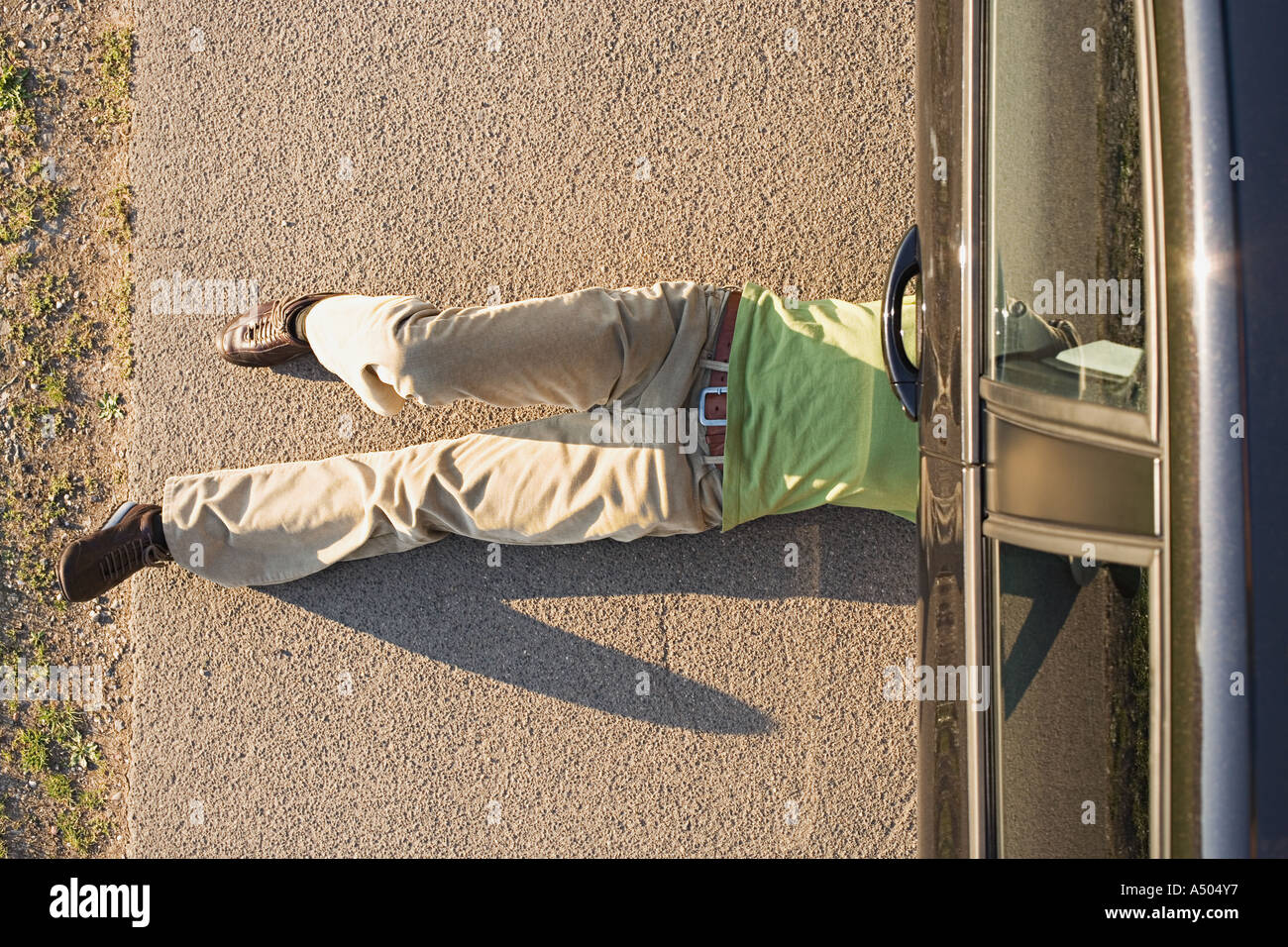 Man under a car Stock Photo - Alamy