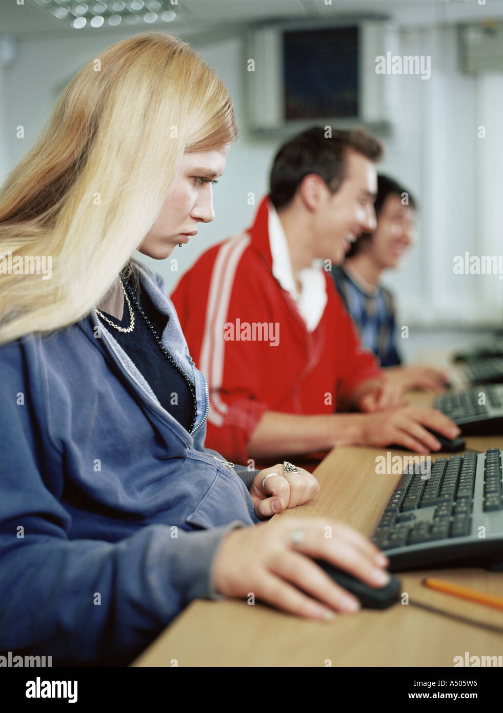 Teenagers using computers Stock Photo - Alamy