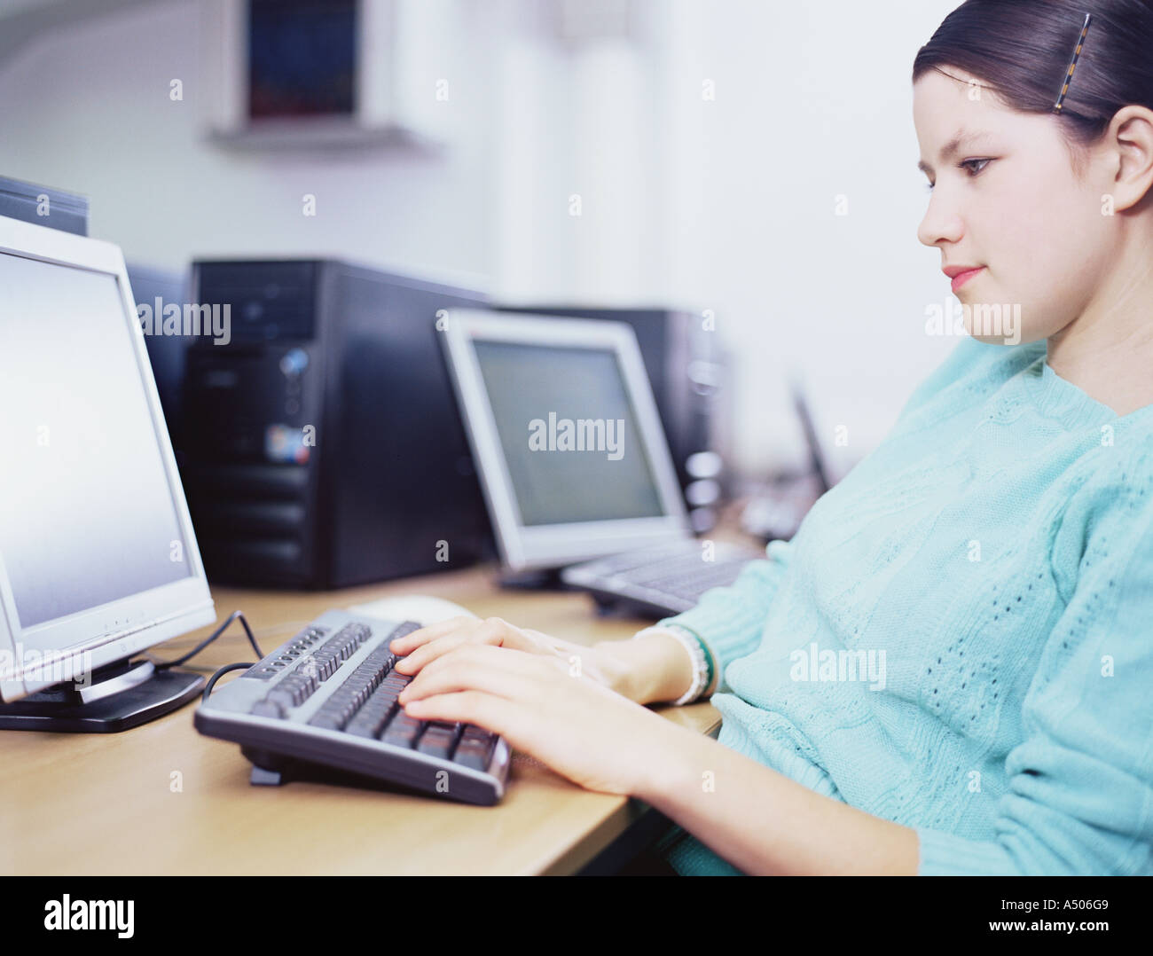 Girl using computer Stock Photo - Alamy