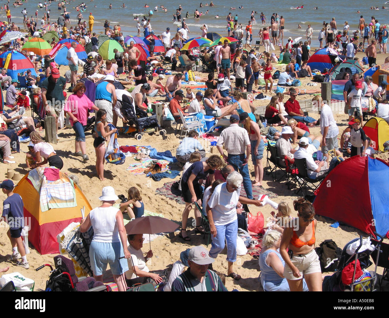 British seaside crowded beach scene, Lowestoft, Suffolk, England ...