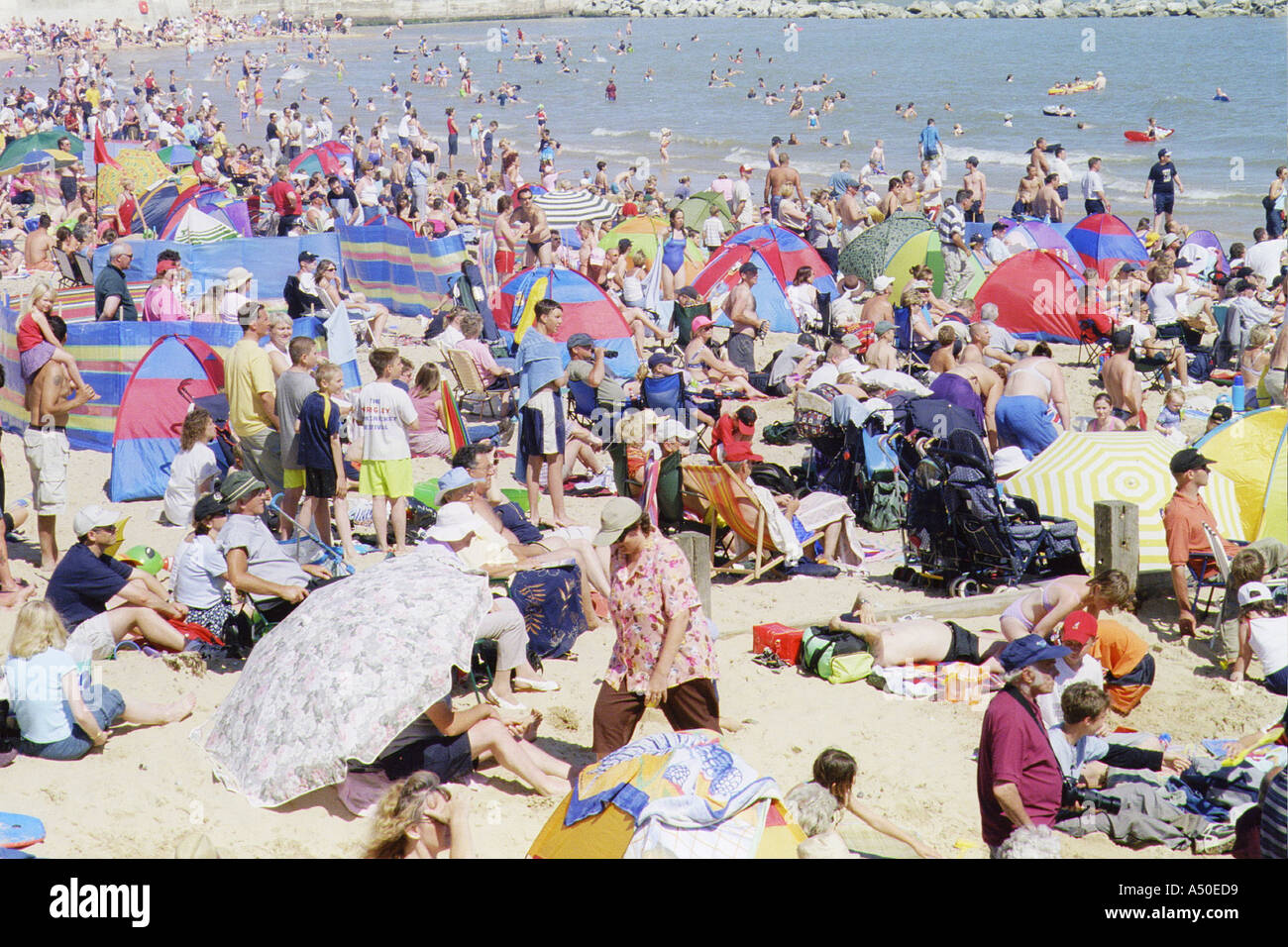 British seaside crowded beach scene, Lowestoft, Suffolk, England ...