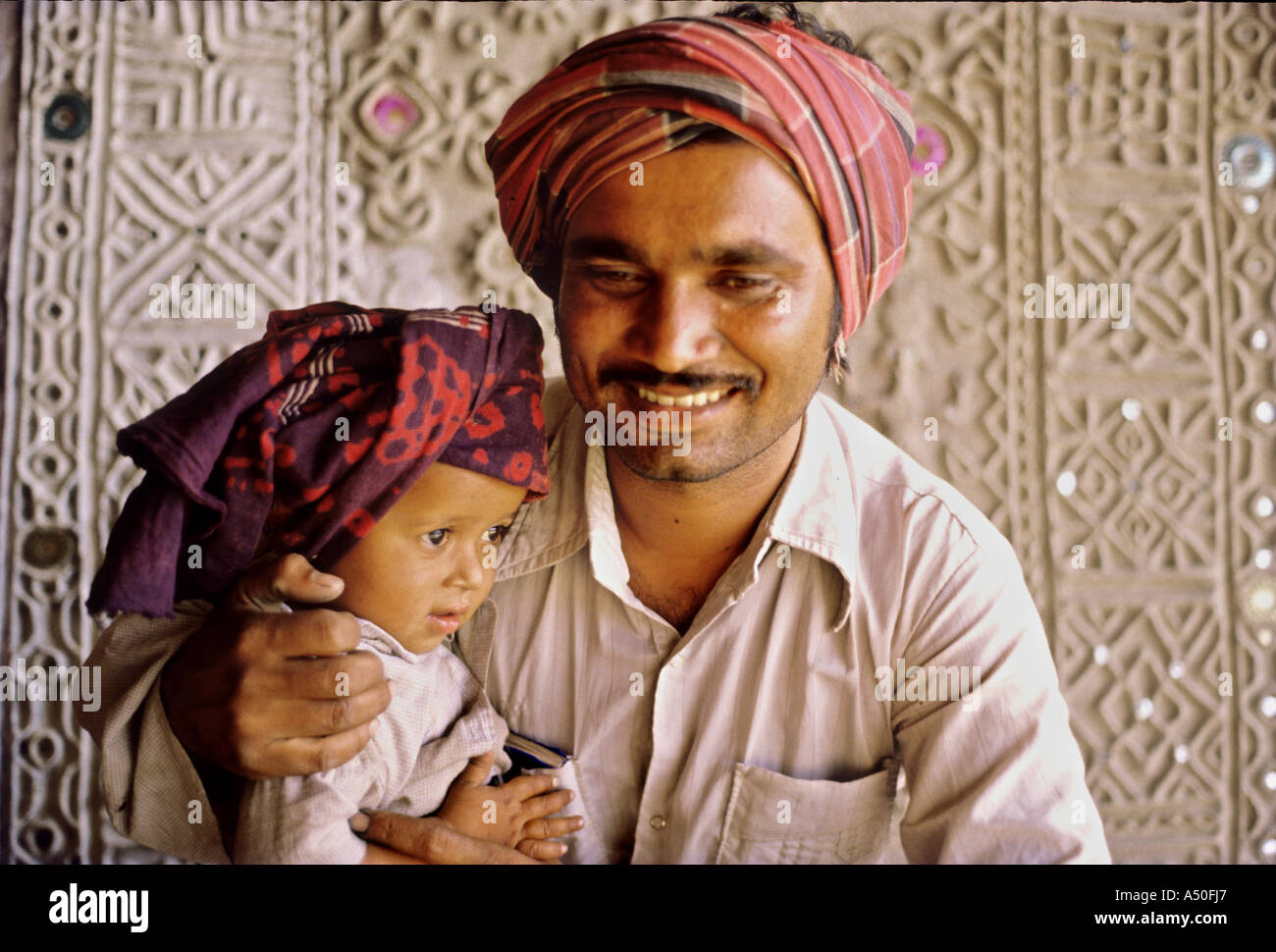 Man holding his child Stock Photo - Alamy