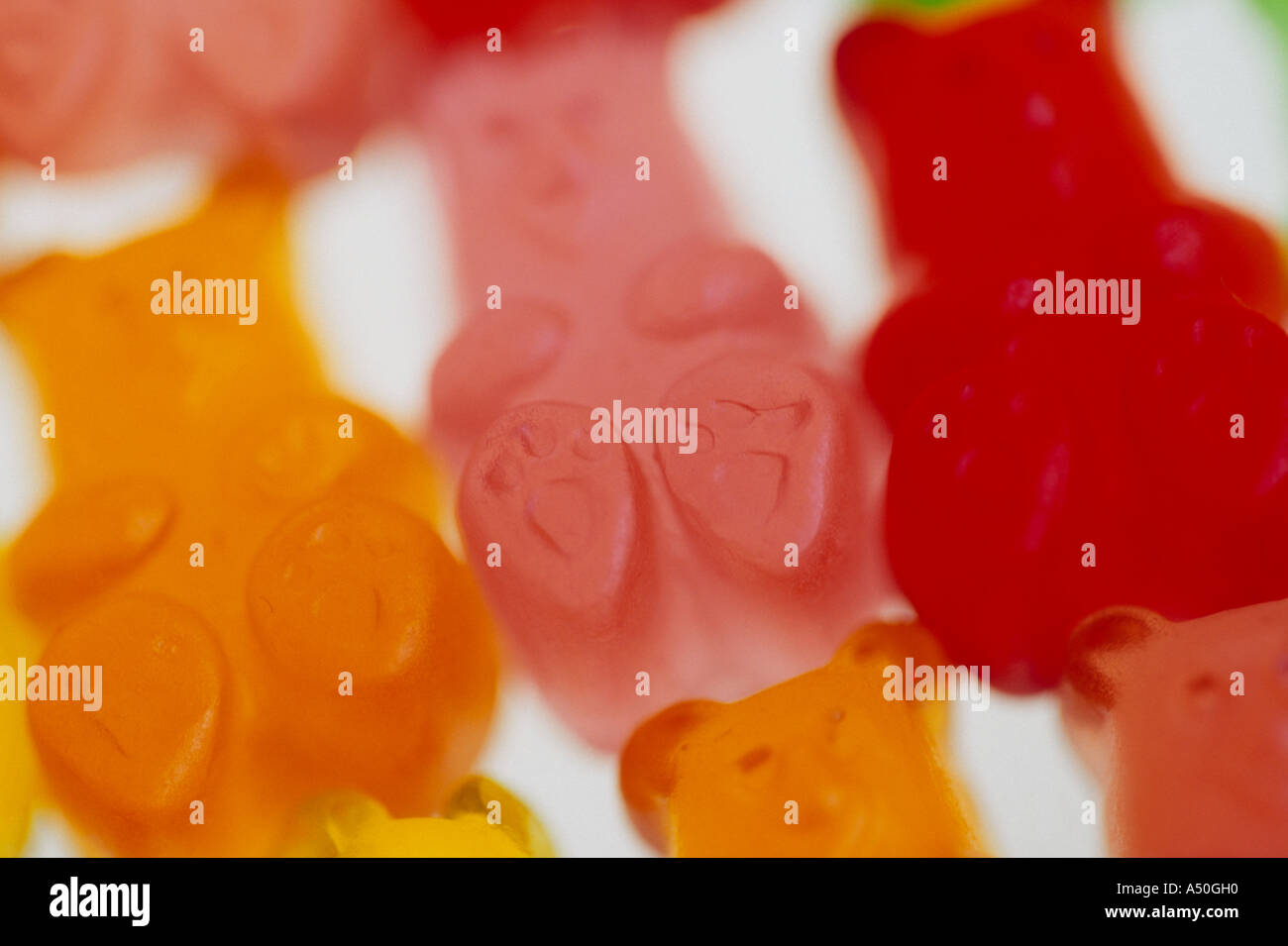 Gummy bears lined up in straight rows Stock Photo - Alamy