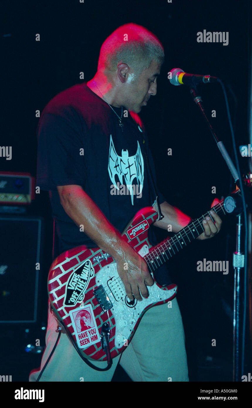 Steve Caballero, of The Faction, plays guitar during a live punk rock ...