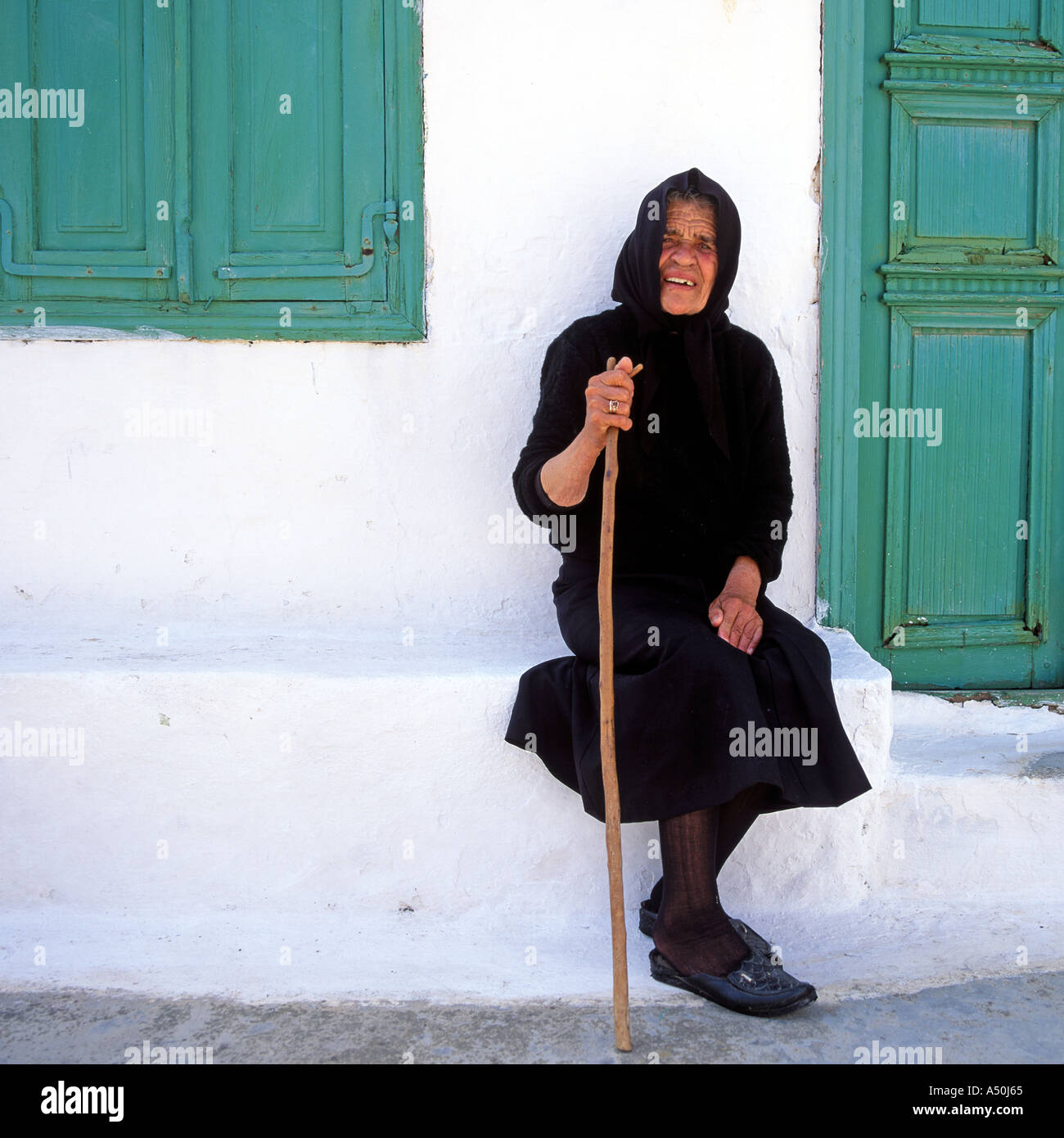 OLD LADY OUTSIDE HER HOME IN GREECE Stock Photo - Alamy