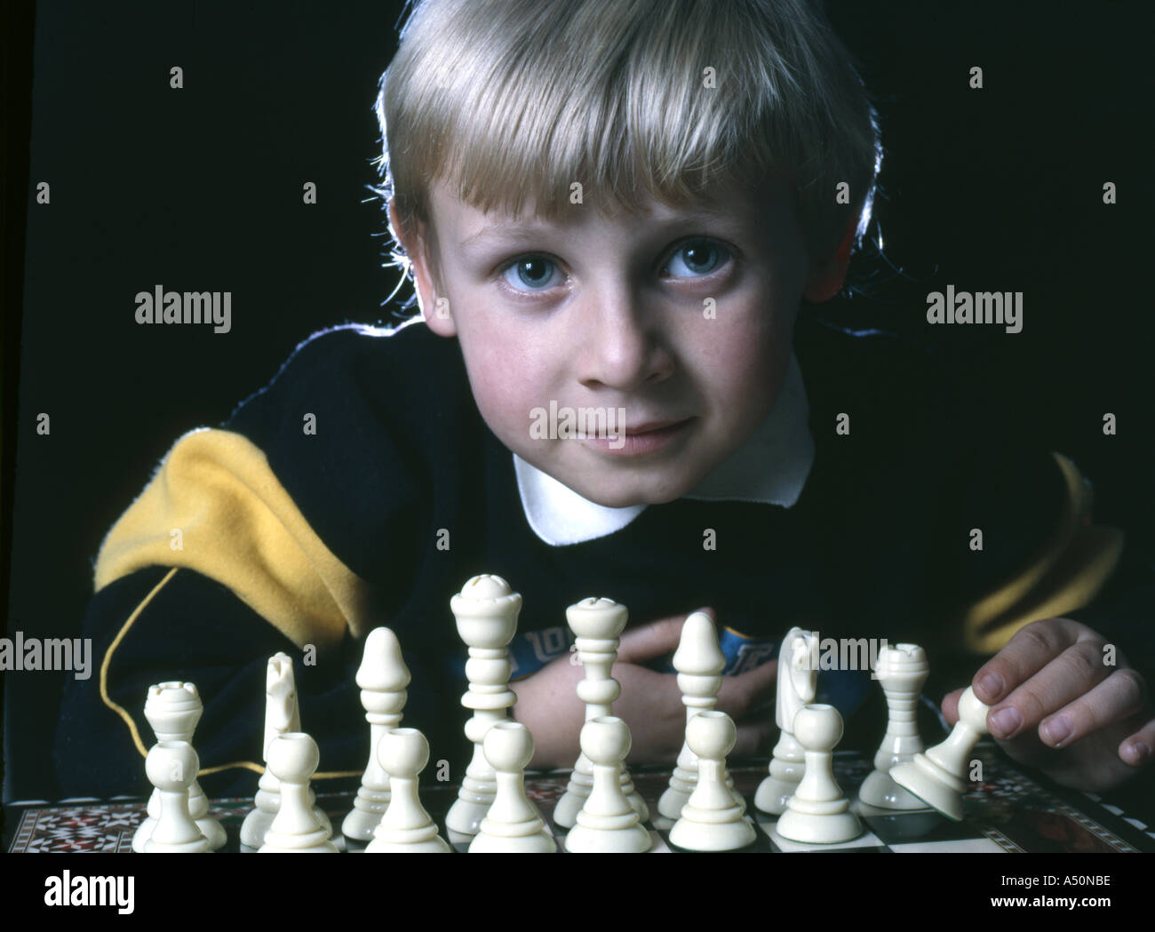Young man with chess set Stock Photo - Alamy