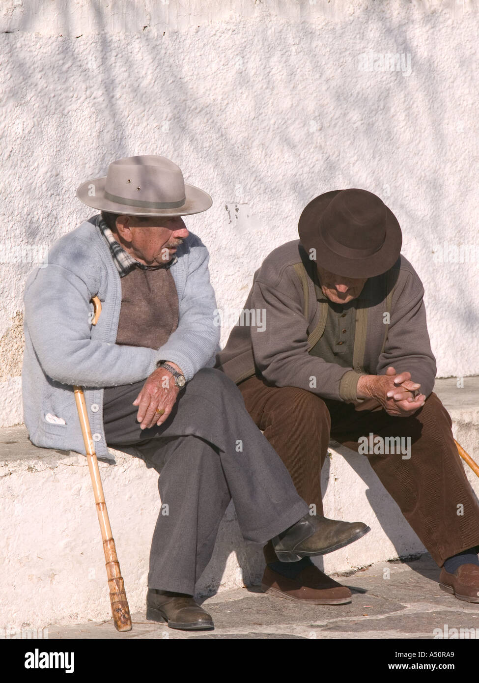 two old spanish men in the village square at Capileira Sierra Nevada ...