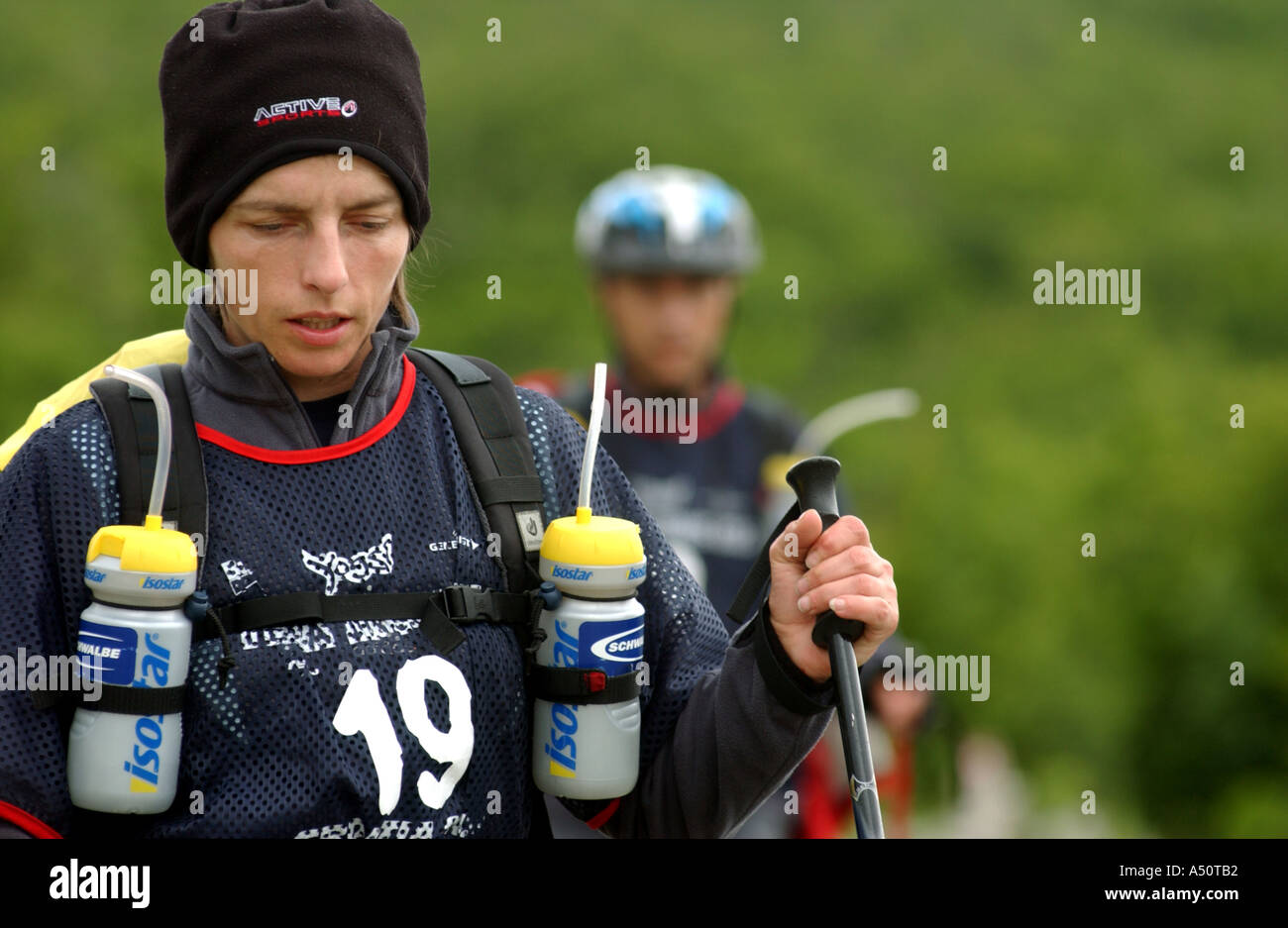 Adventure race team trekking in mountains Stock Photo - Alamy