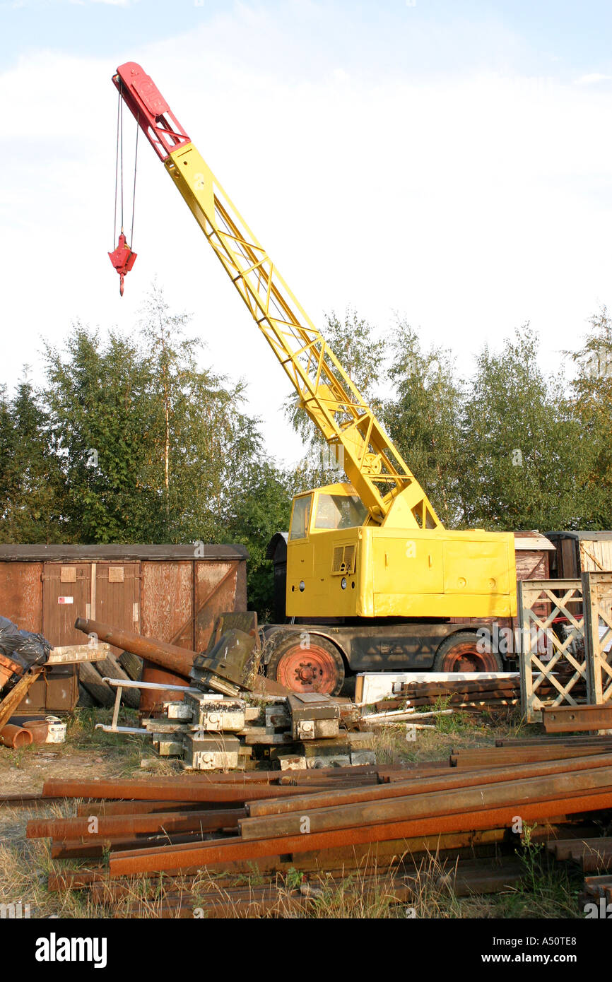 Yellow crane in car park Stock Photo - Alamy
