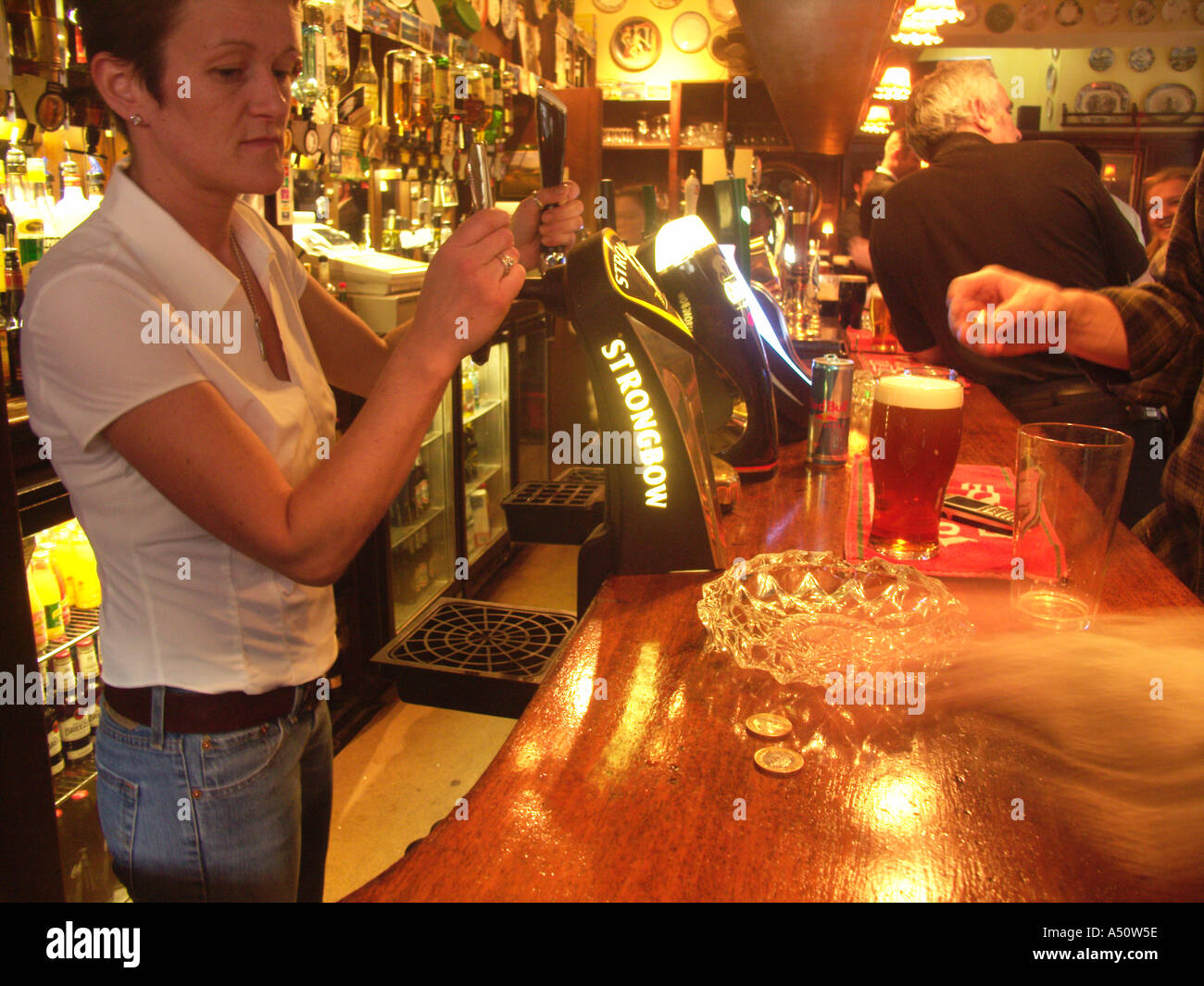 Barmaid pulling a pint hi-res stock photography and images - Alamy