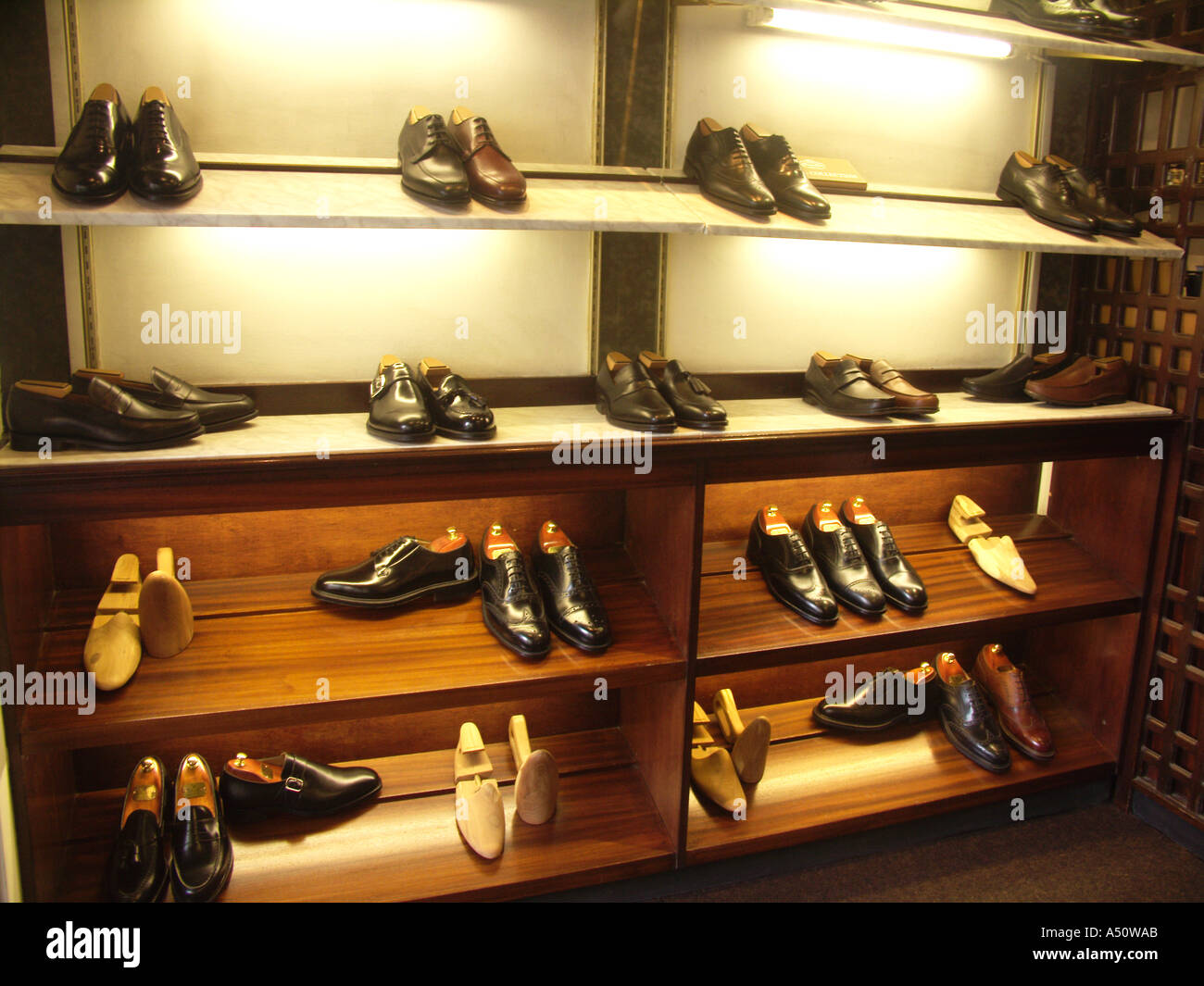 Expensive luxury shoes on display in City of London shop London England ...