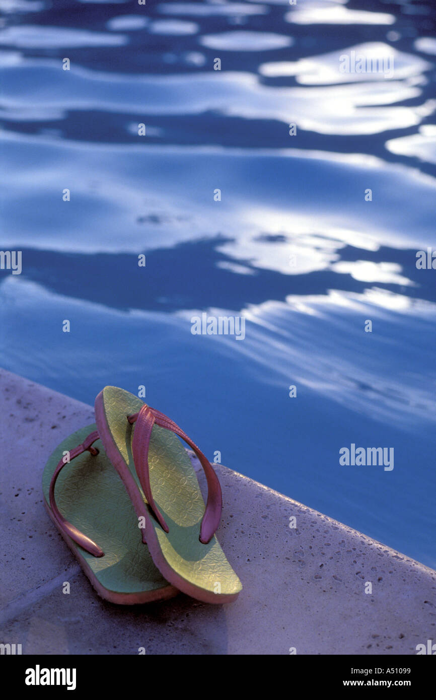 Beach slippers along edge of swimming pool California Stock Photo - Alamy