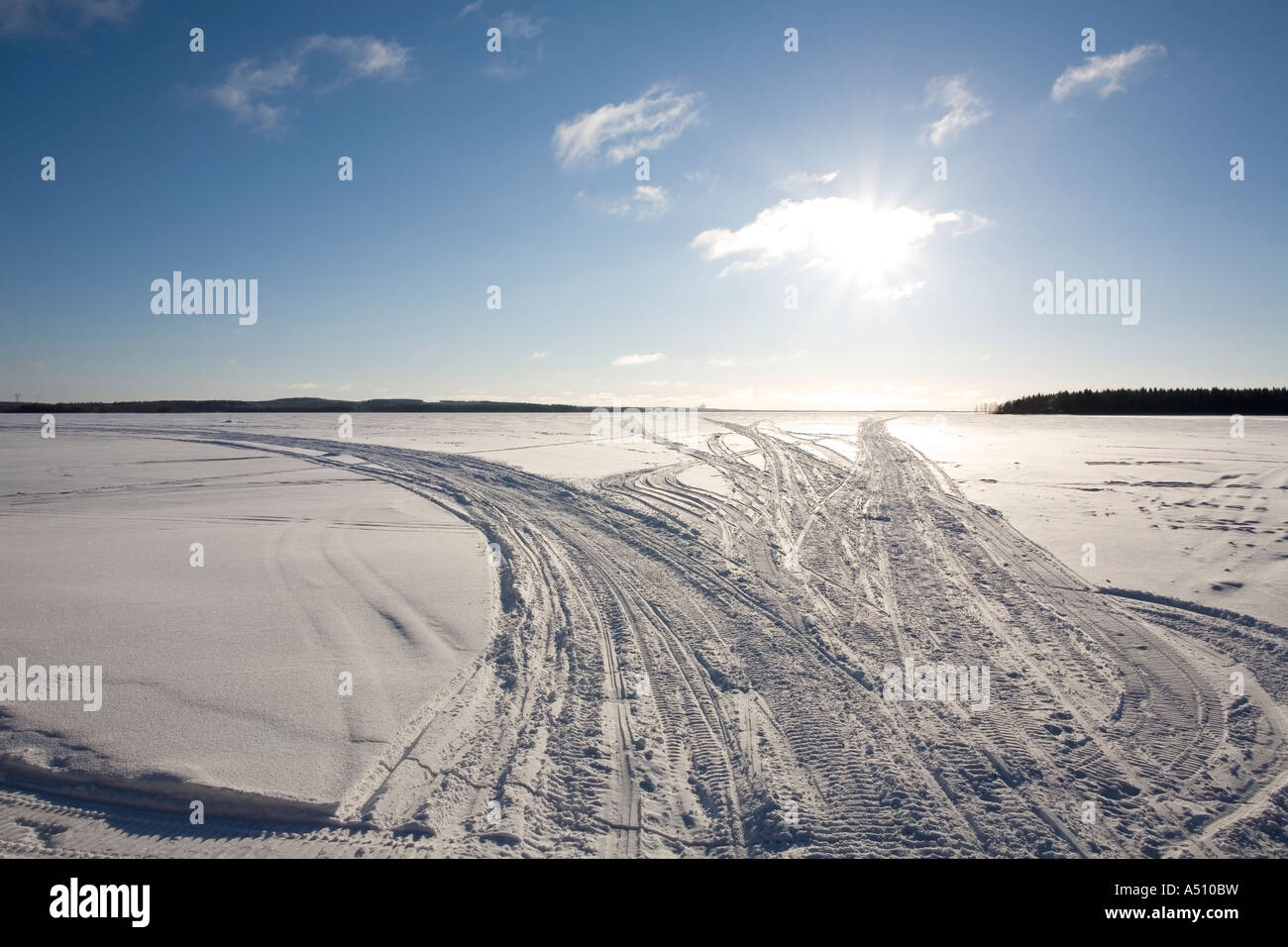 snowmobile trails on frozen lake, Finland Stock Photo - Alamy