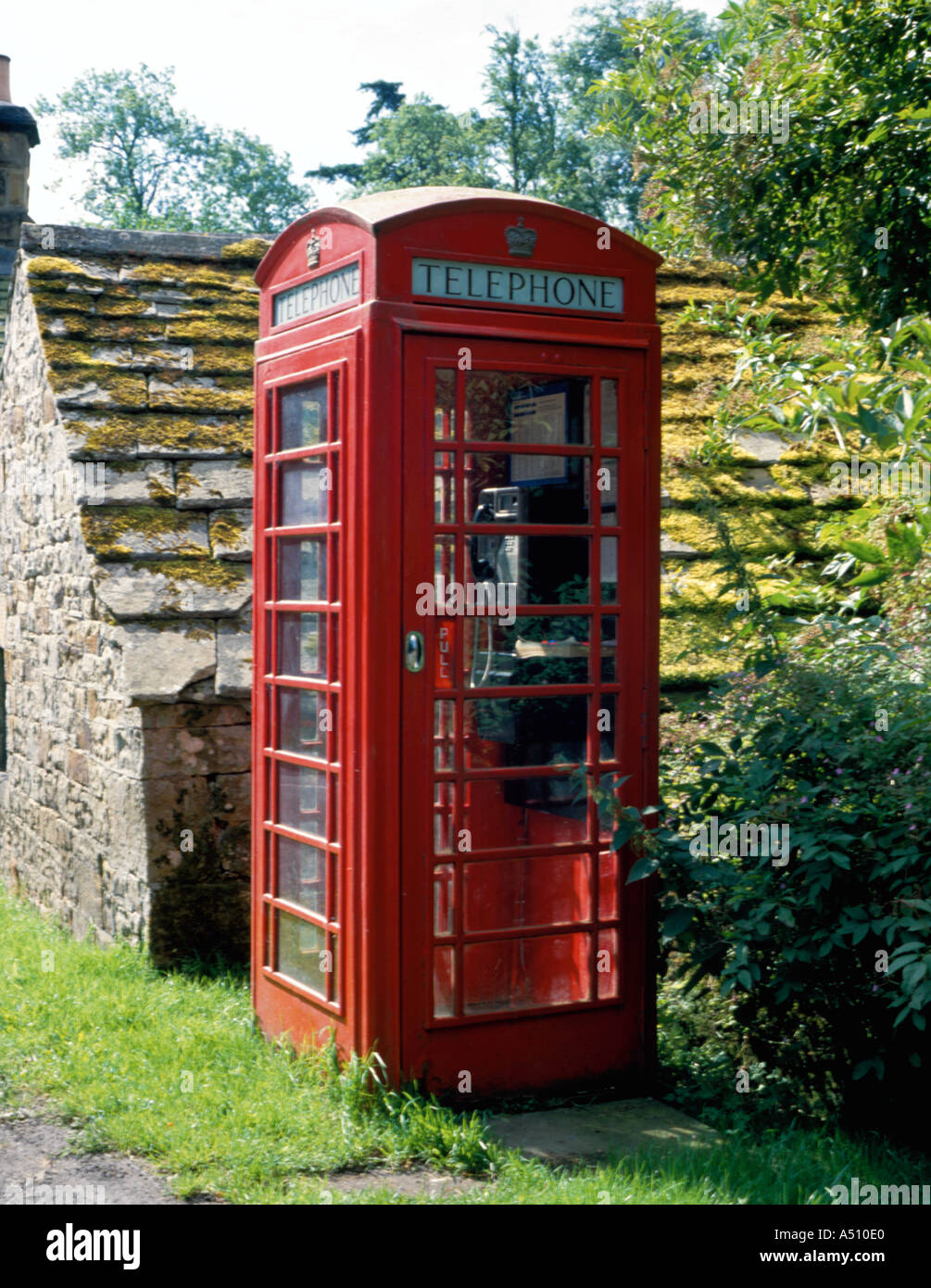 Classic red painted, Gilbert Scott designed, cast iron telephone box in ...