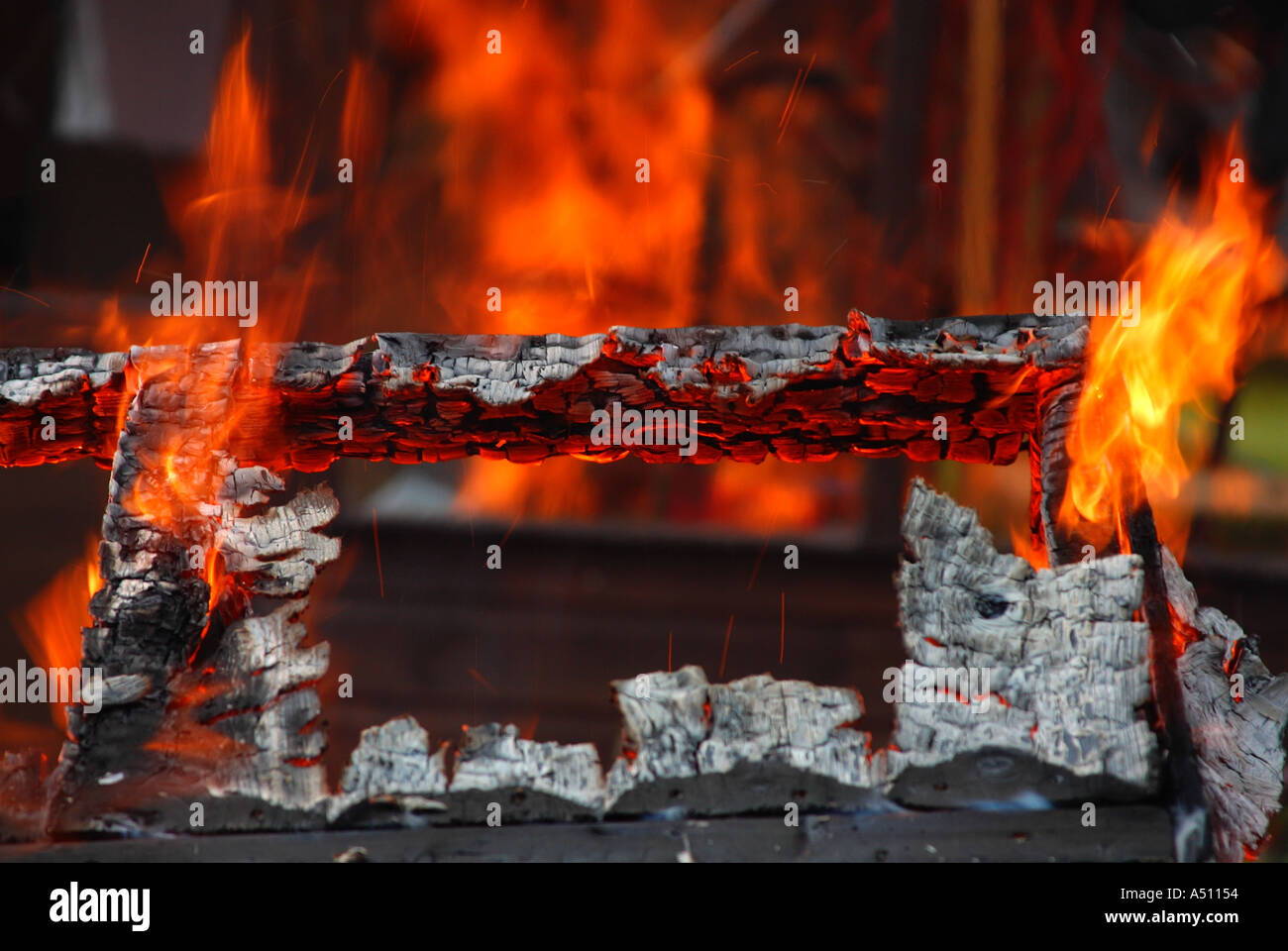 Fire and charred wood Stock Photo - Alamy