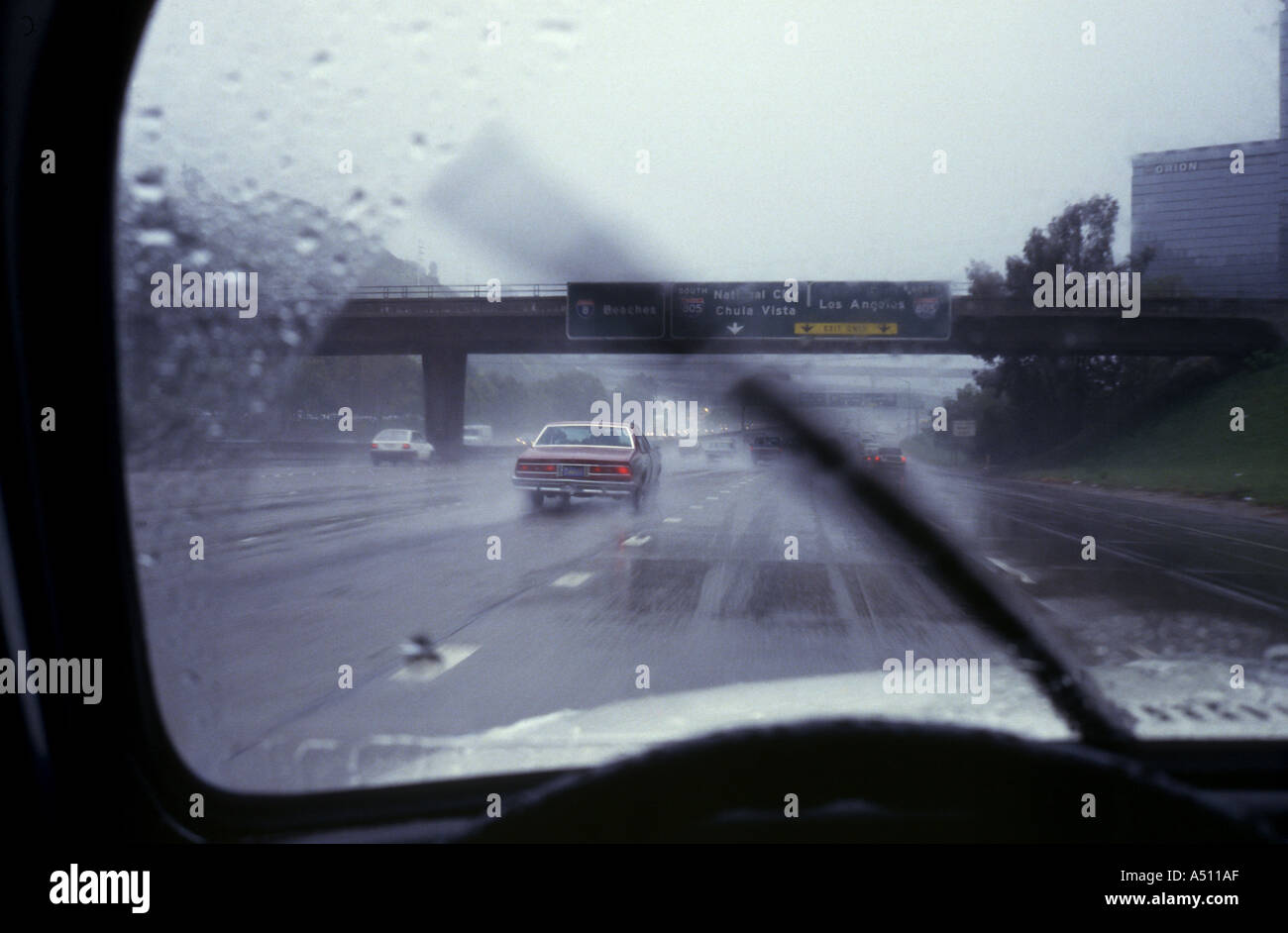 Looking through windshield of car on expressway in rain Stock Photo - Alamy