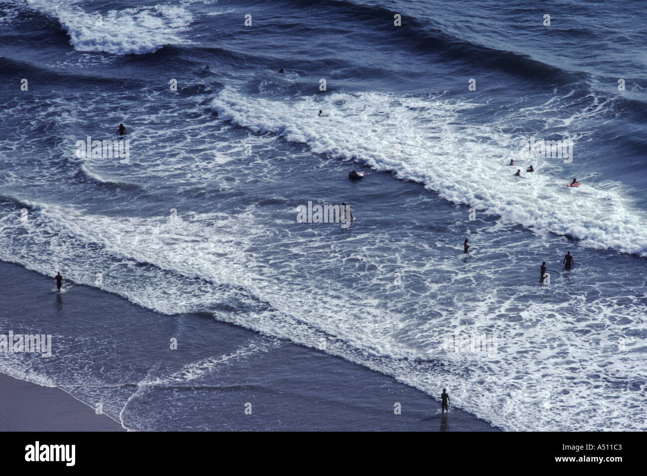 Aerial view swimmers in ocean surf Stock Photo - Alamy