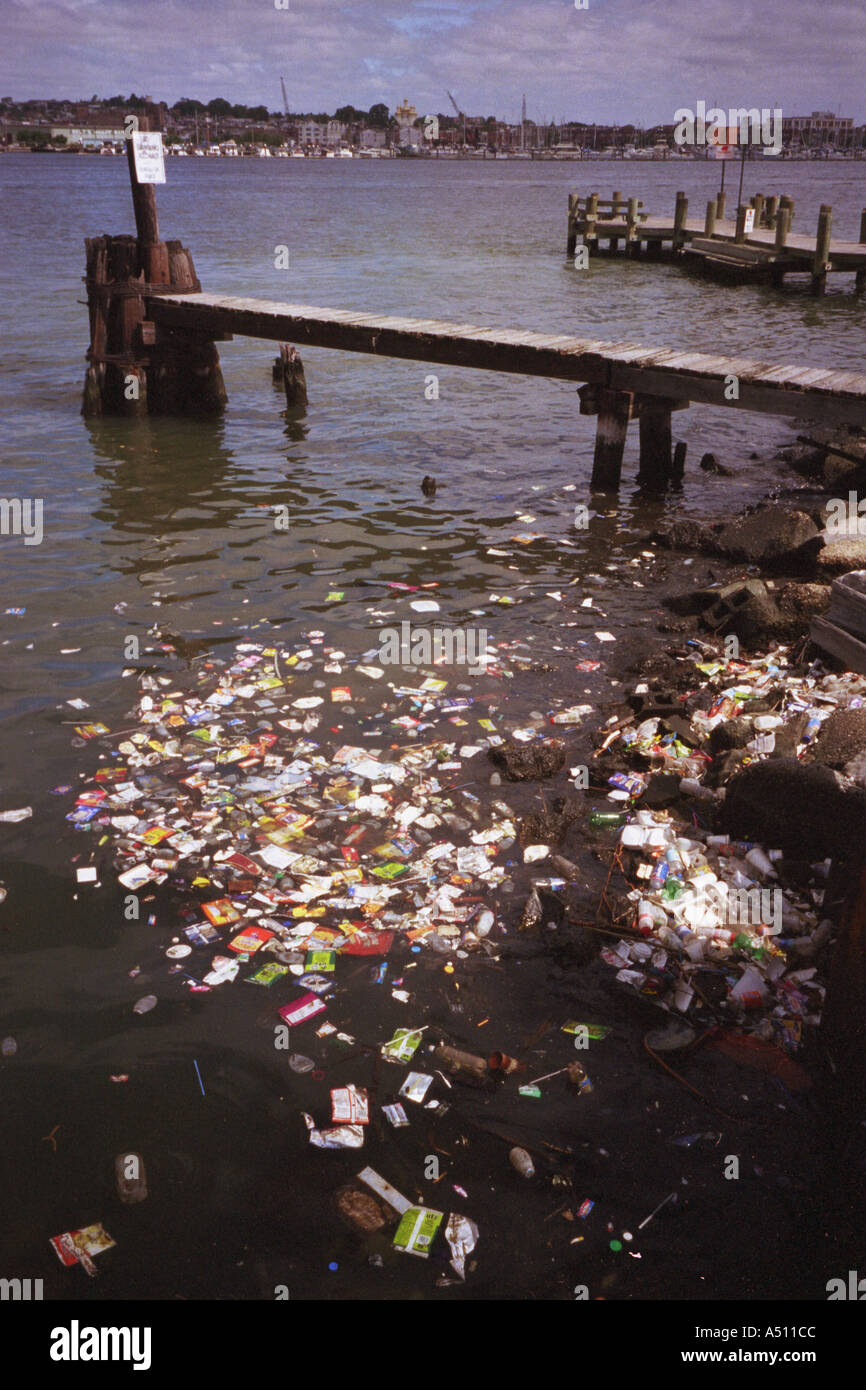 Trash in water along shoreline Stock Photo - Alamy