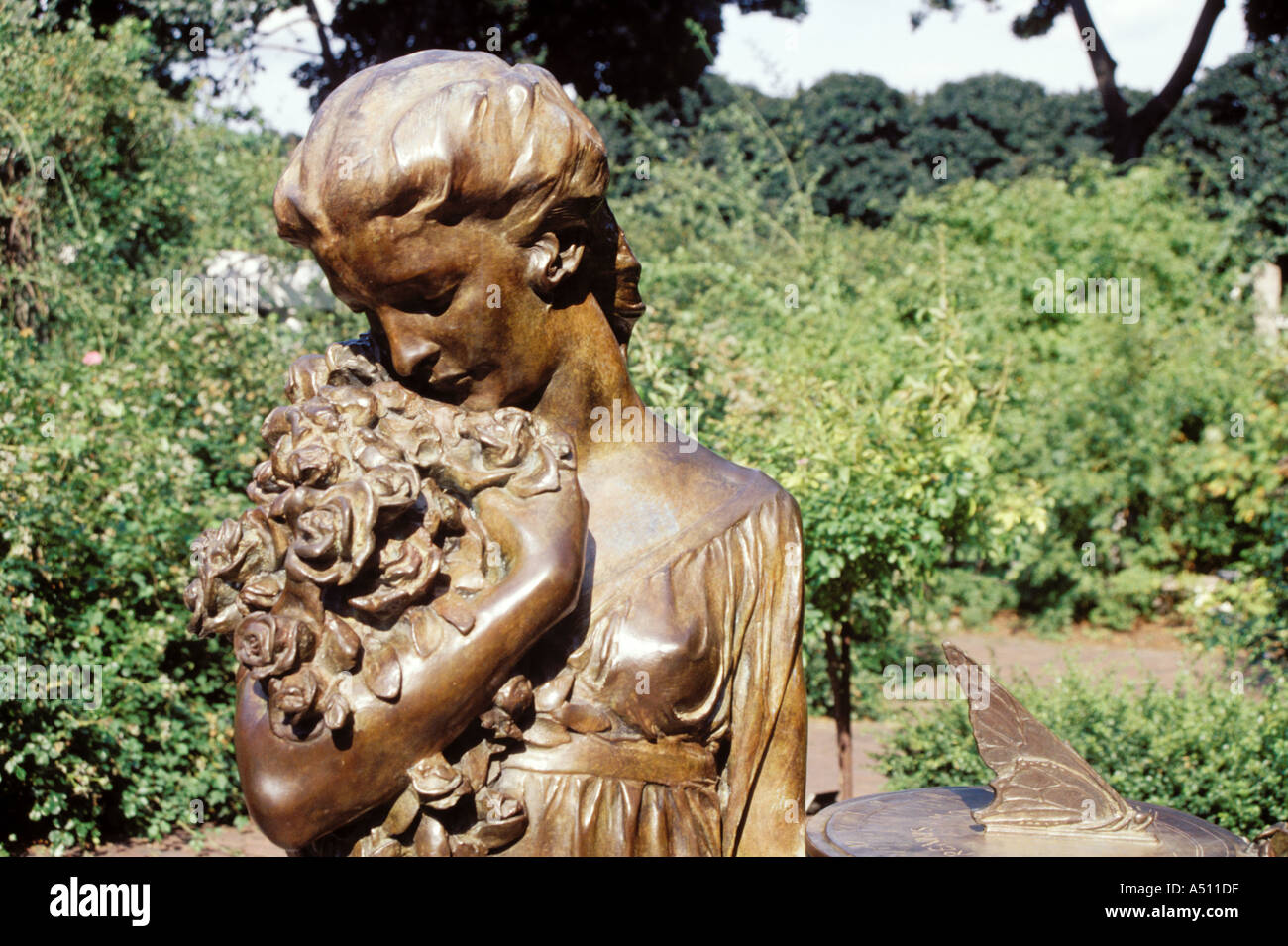 Garden Statue of woman with sundial Brooklyn Botanic Garden USA Stock ...