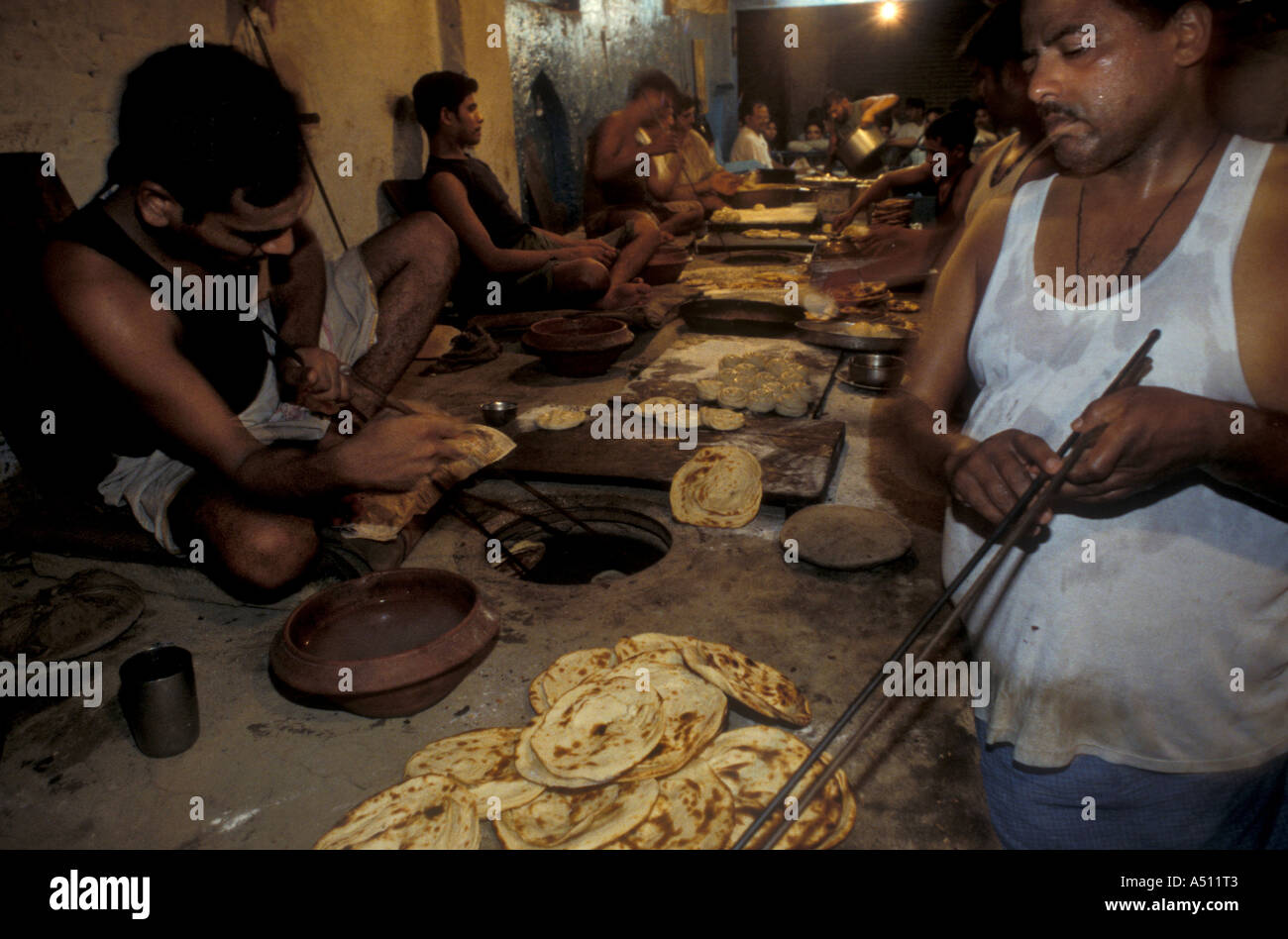Men making food Stock Photo - Alamy