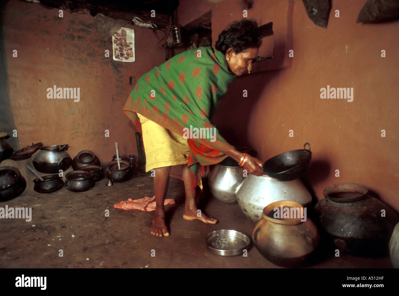 Old Tribal woman cooking food Koraput district Orissa India Stock Photo ...