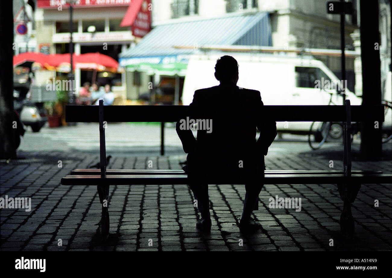A man sits on a park bench in Paris, France Stock Photo - Alamy