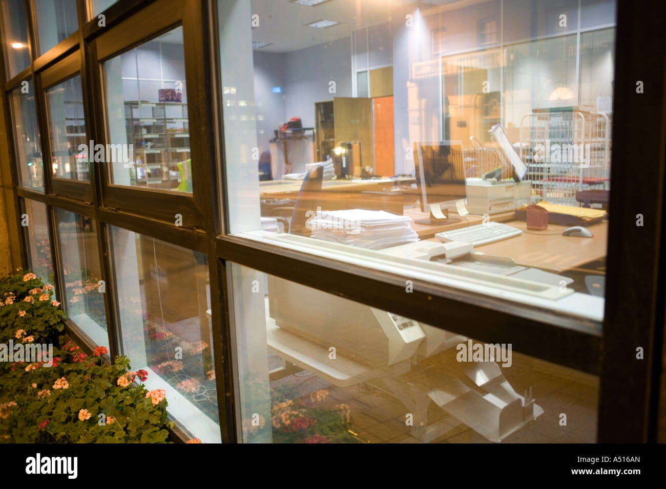 Office buildings at night with lights left on - energy waste causes ...