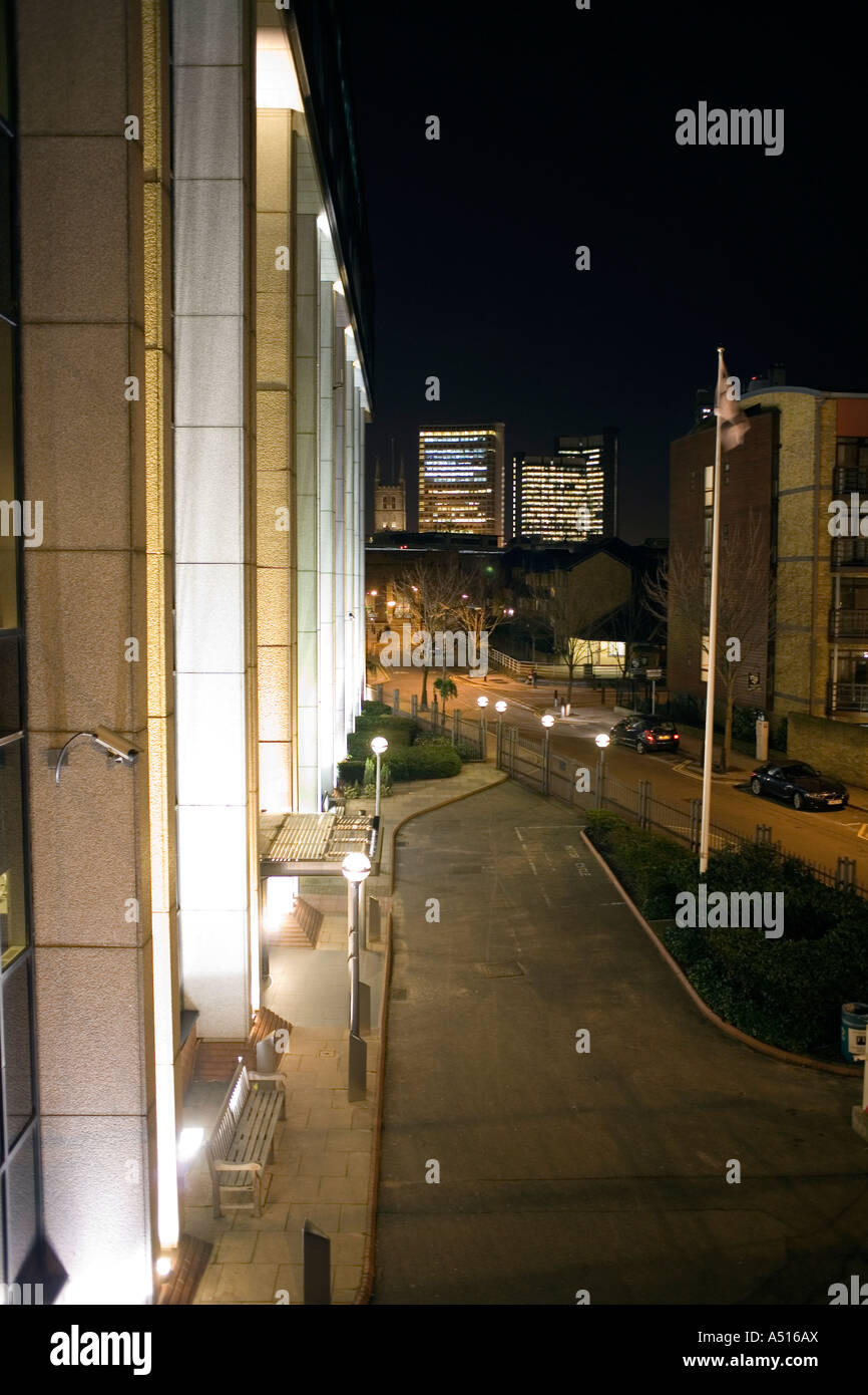 Office buildings at night with lights left on - energy waste causes ...