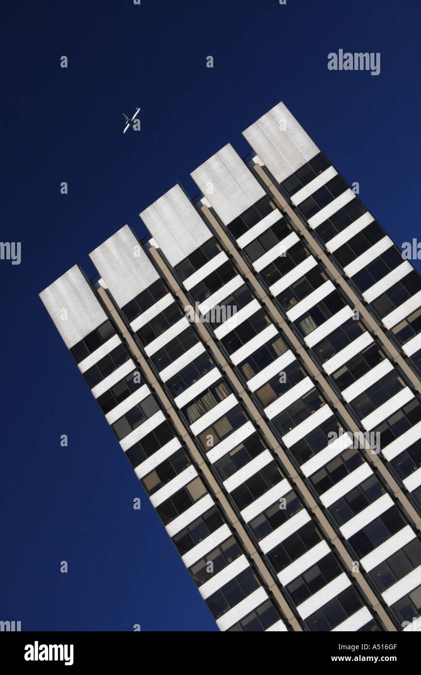 Plane passes overhead of a London skyscraper building Stock Photo - Alamy