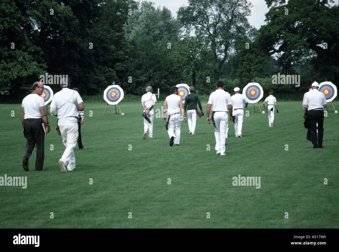 Archers walking towards long line of archery targets after completing a ...