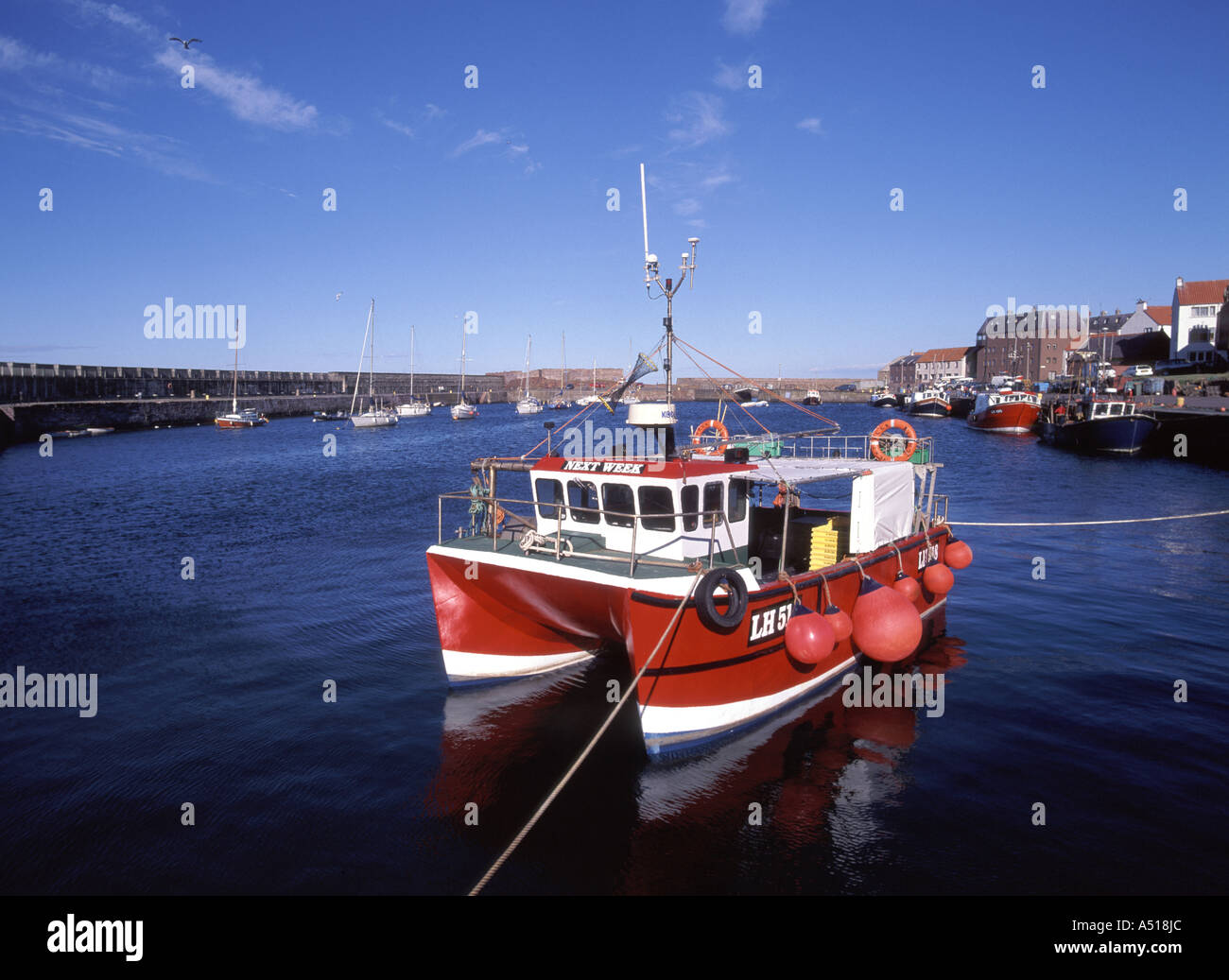 Dunbar harbour with moored fishing boat Stock Photo - Alamy
