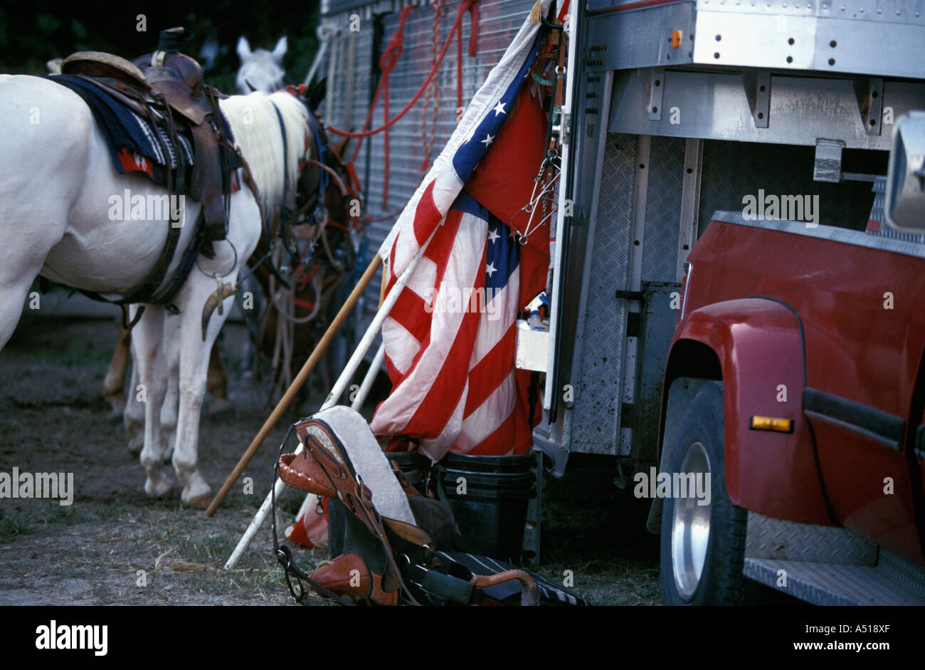 American flags leaning against horse trailer Stock Photo - Alamy