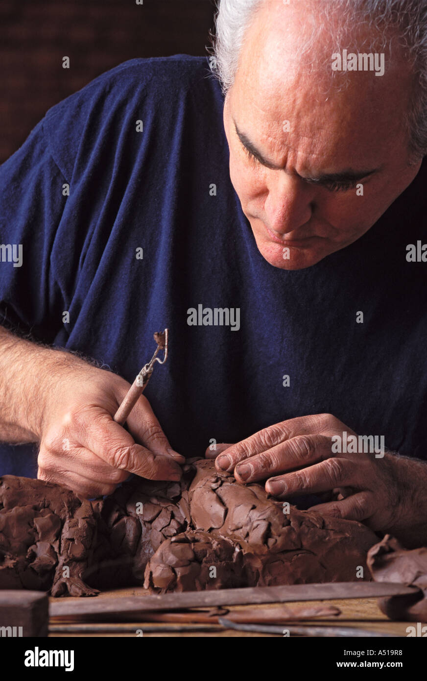sculpture working with clay Stock Photo - Alamy