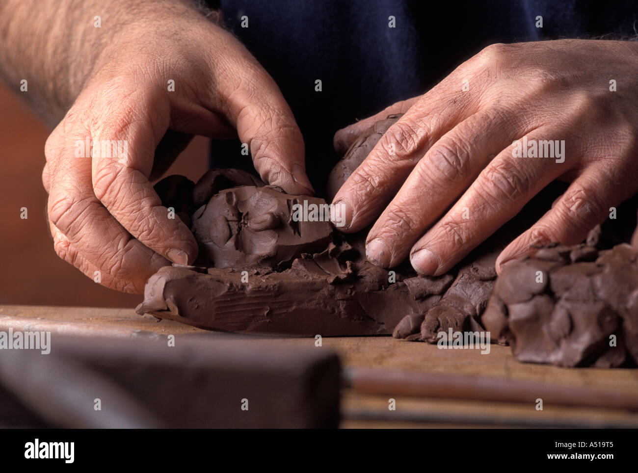 sculpture working with clay Stock Photo - Alamy