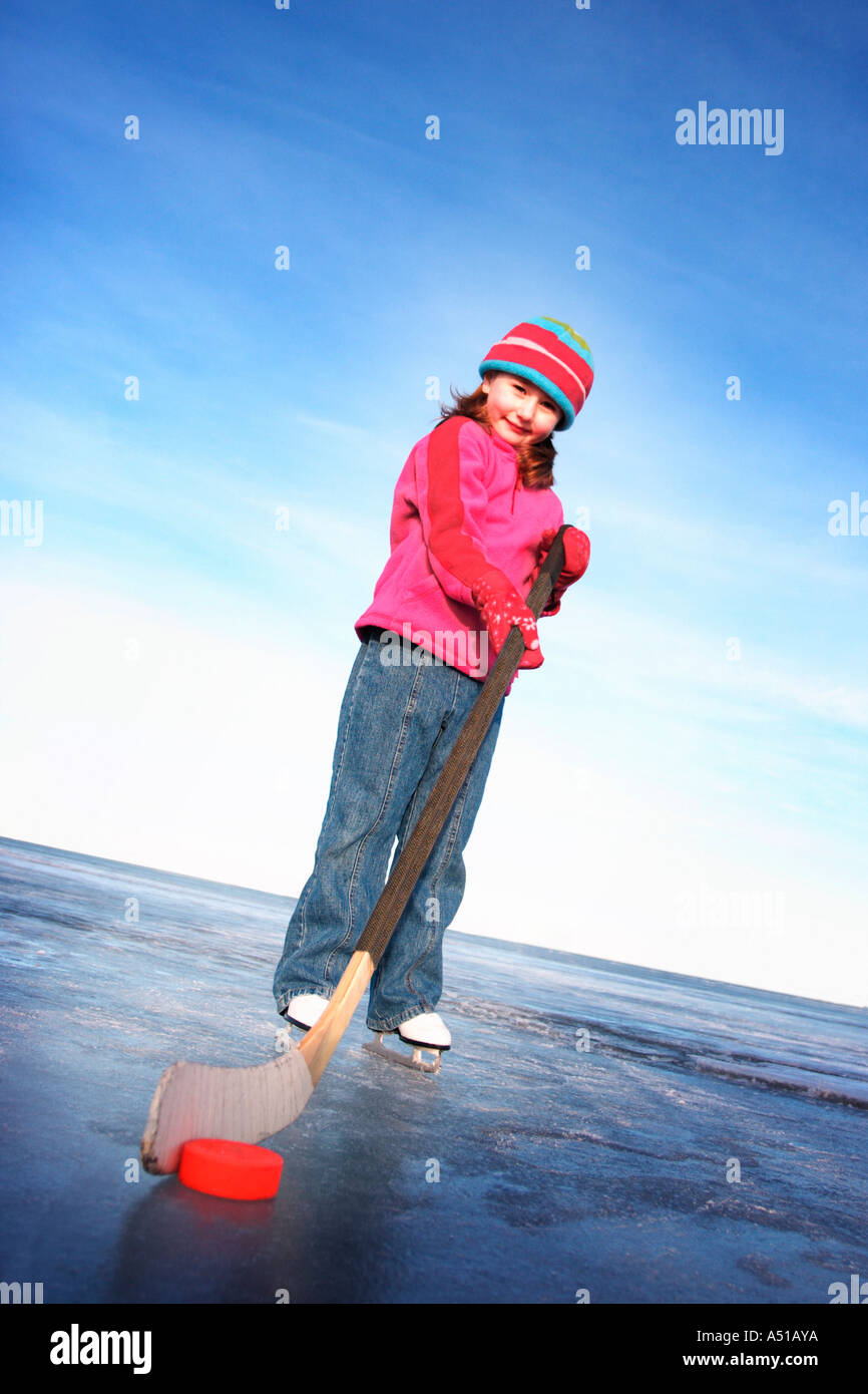 Children playing ice hockey puck hi-res stock photography and images ...
