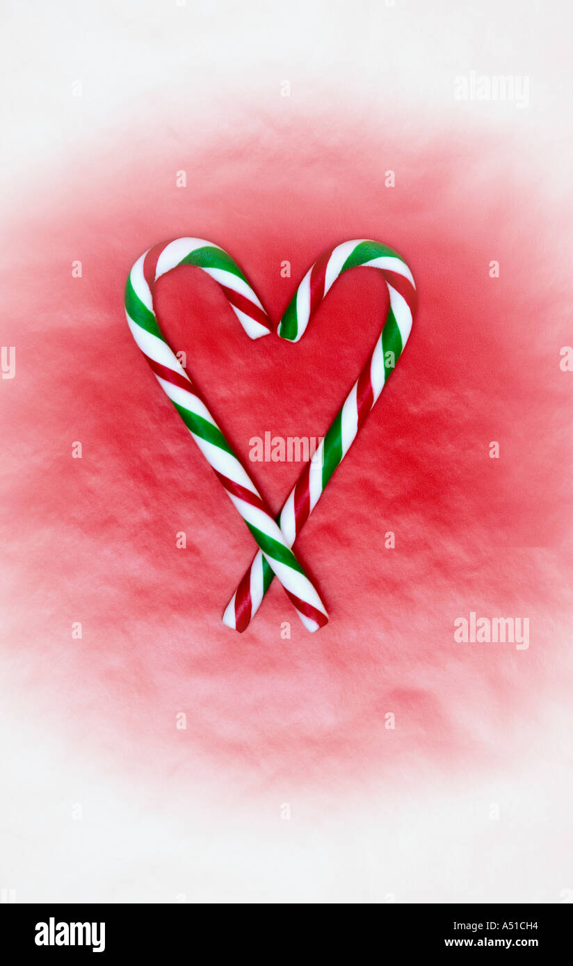 Two heart shaped candy canes Stock Photo - Alamy