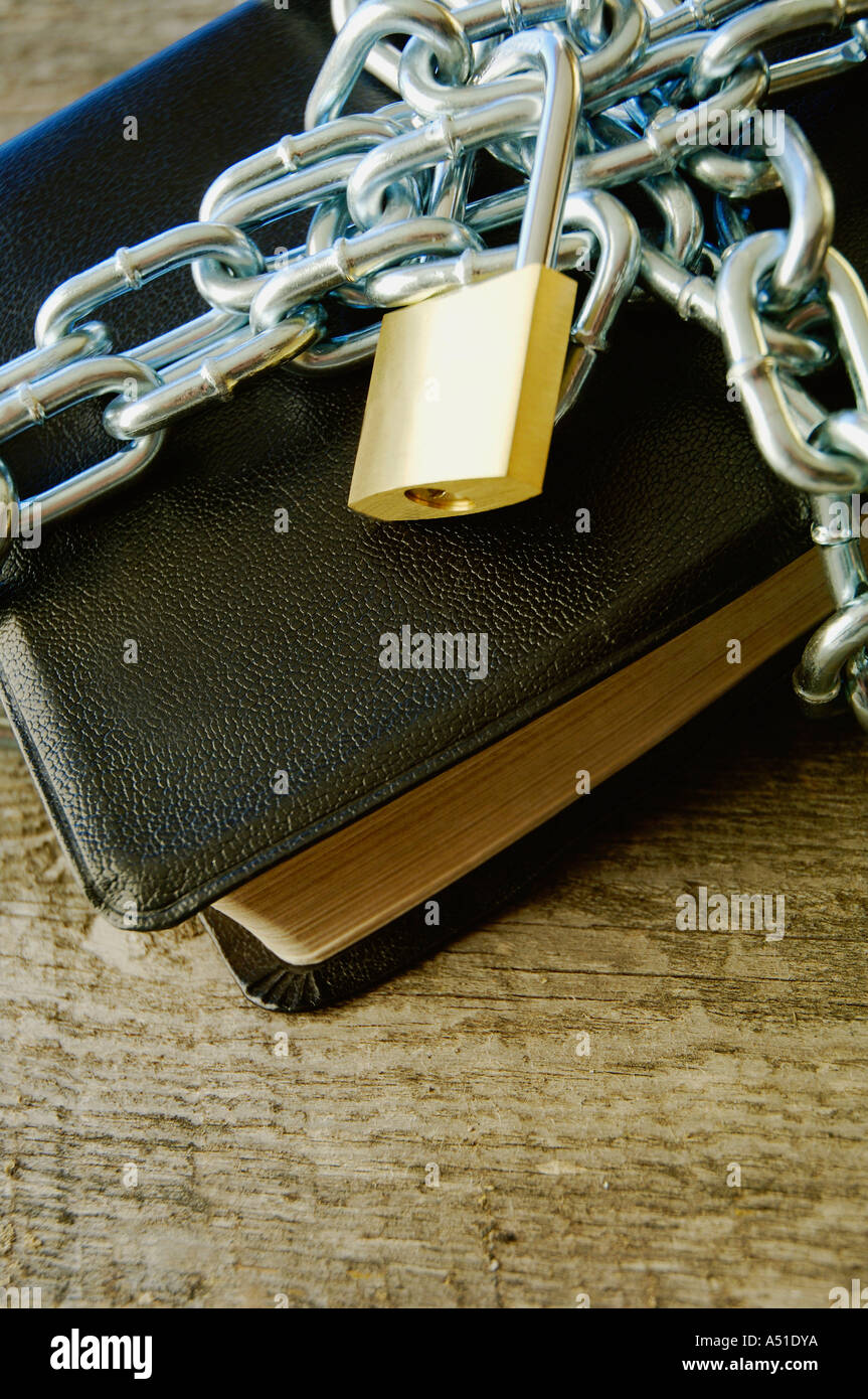 Bible with a chain and lock Stock Photo - Alamy