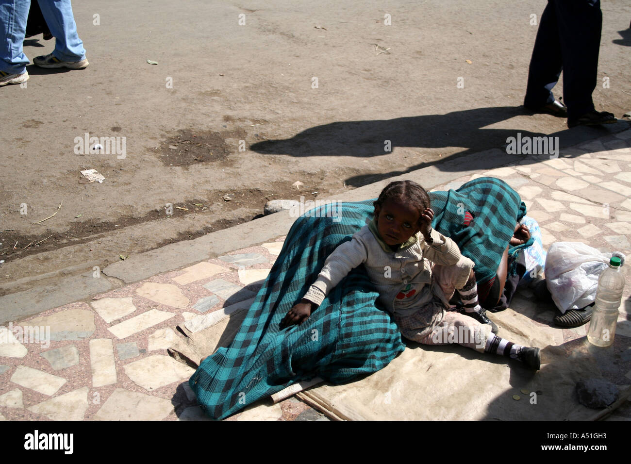 Ethiopia, Addis Ababa, homless mother and daughter in the street near ...