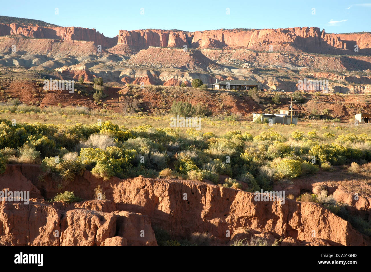Utah Rugged scenery cliffs buildings wilderness red cliffs gulleys ...