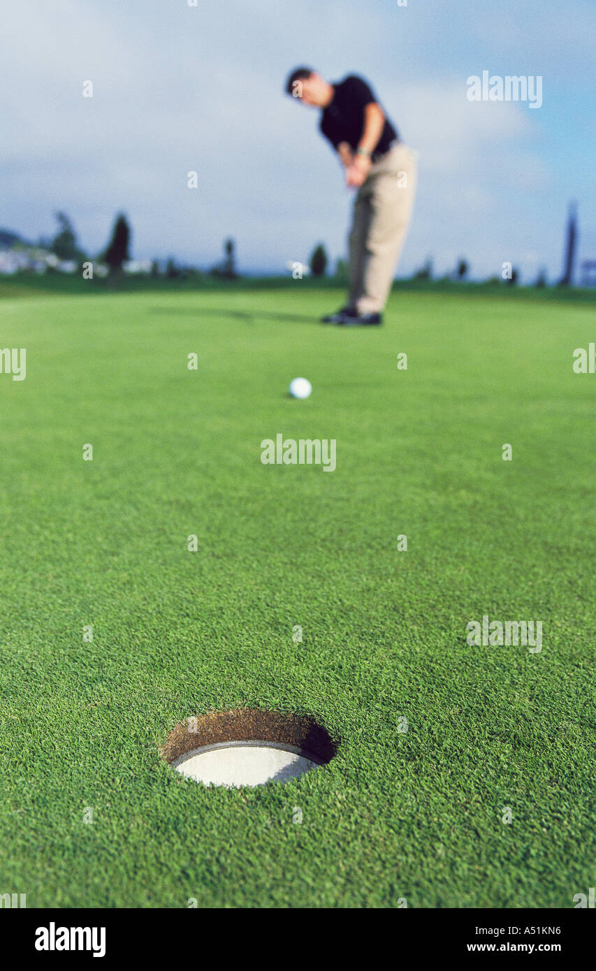 Green competitor golfer putting hi-res stock photography and images - Alamy