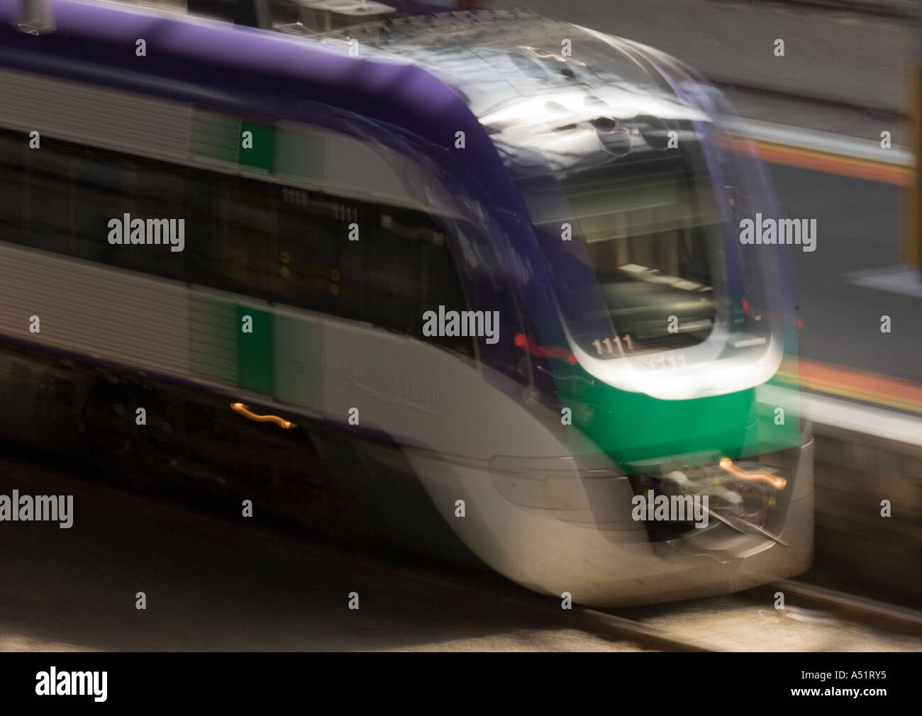 A moving high speed train at station platform Stock Photo - Alamy