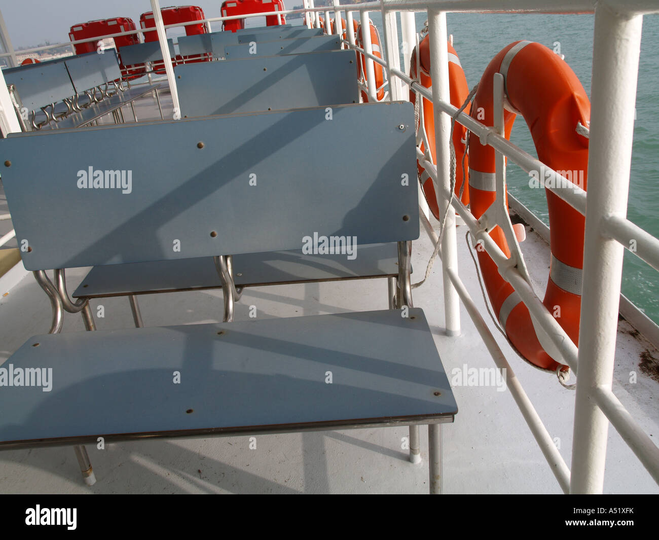 Benches at deck of a ship Stock Photo - Alamy