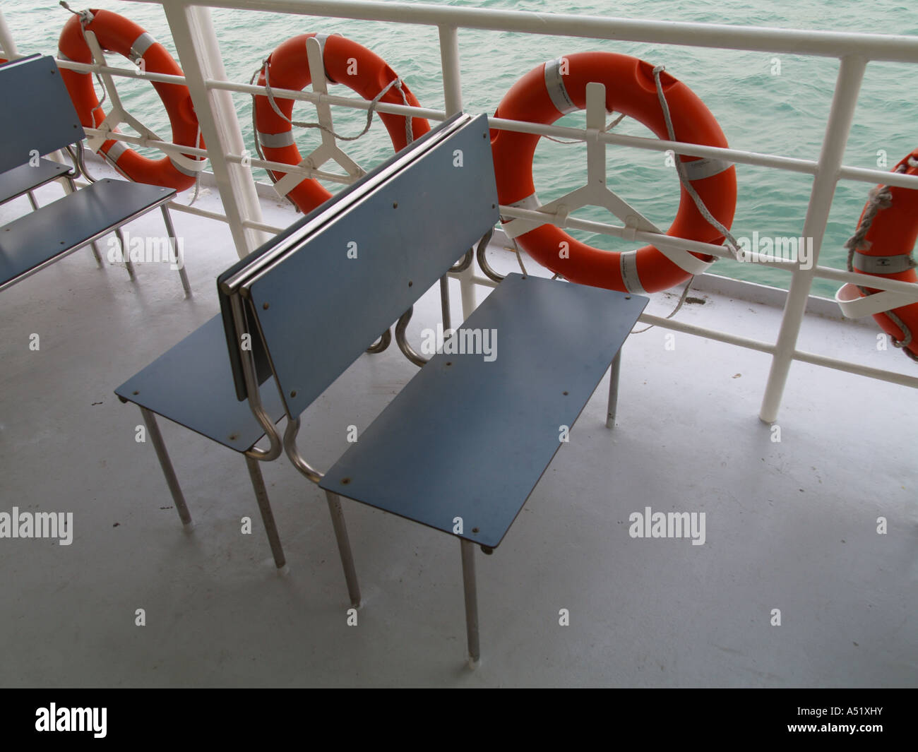 Benches at deck of a ship Stock Photo - Alamy