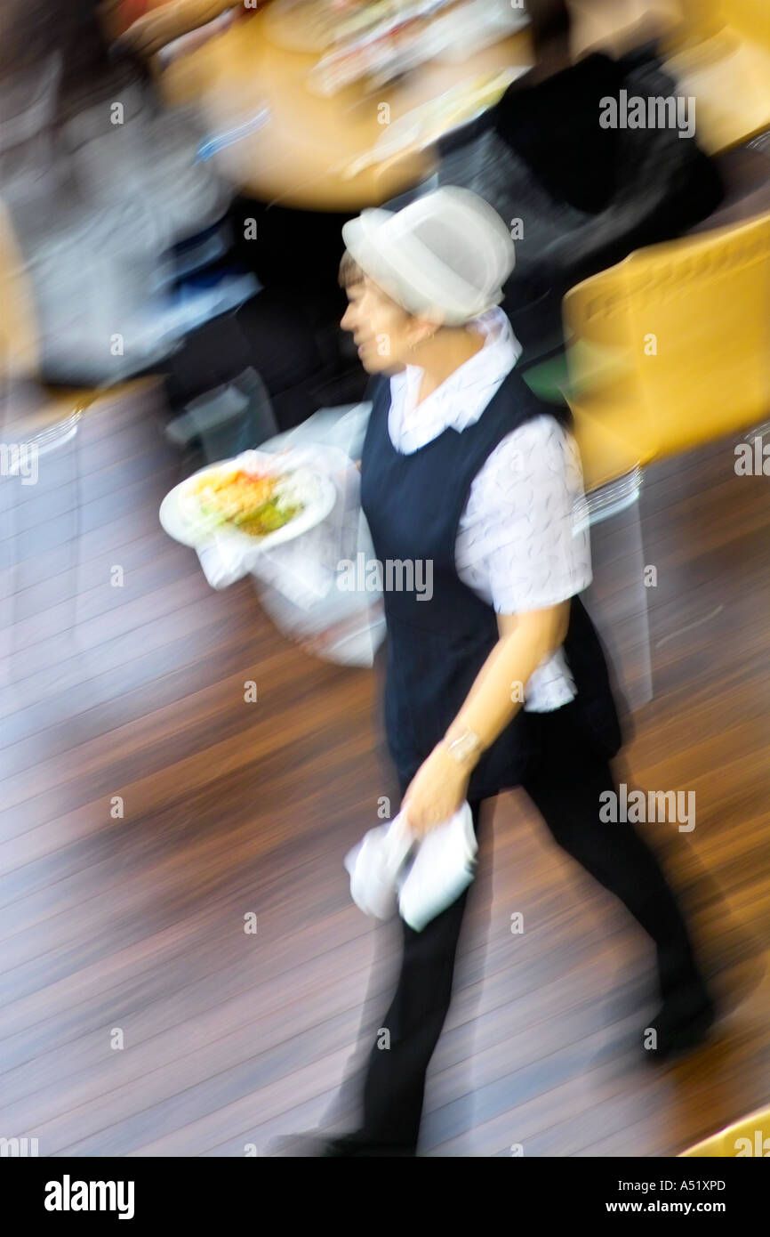 Fast food waitress serving food Stock Photo - Alamy