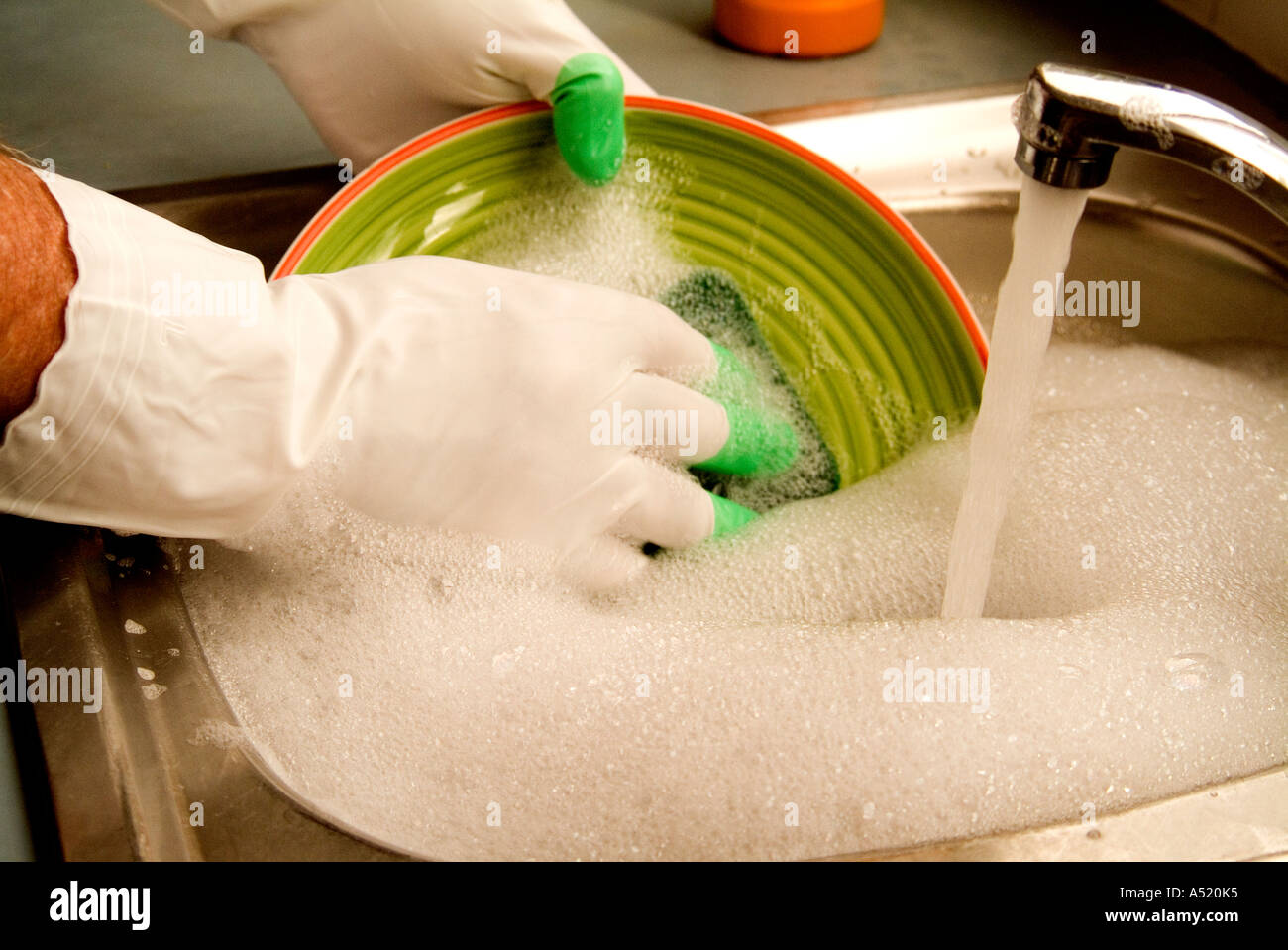 Man washing dishes by hand Stock Photo - Alamy