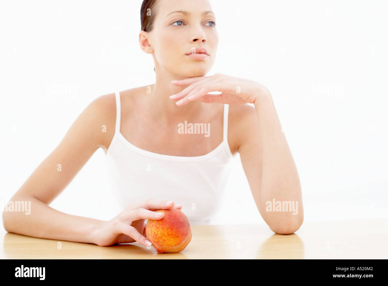 Woman wearing peach top hi-res stock photography and images - Alamy