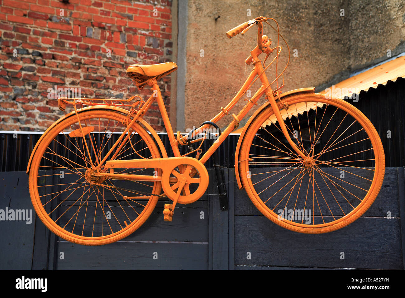 Yellow bicycle mounted on the Bike rental shed in Lymington Hampshire ...