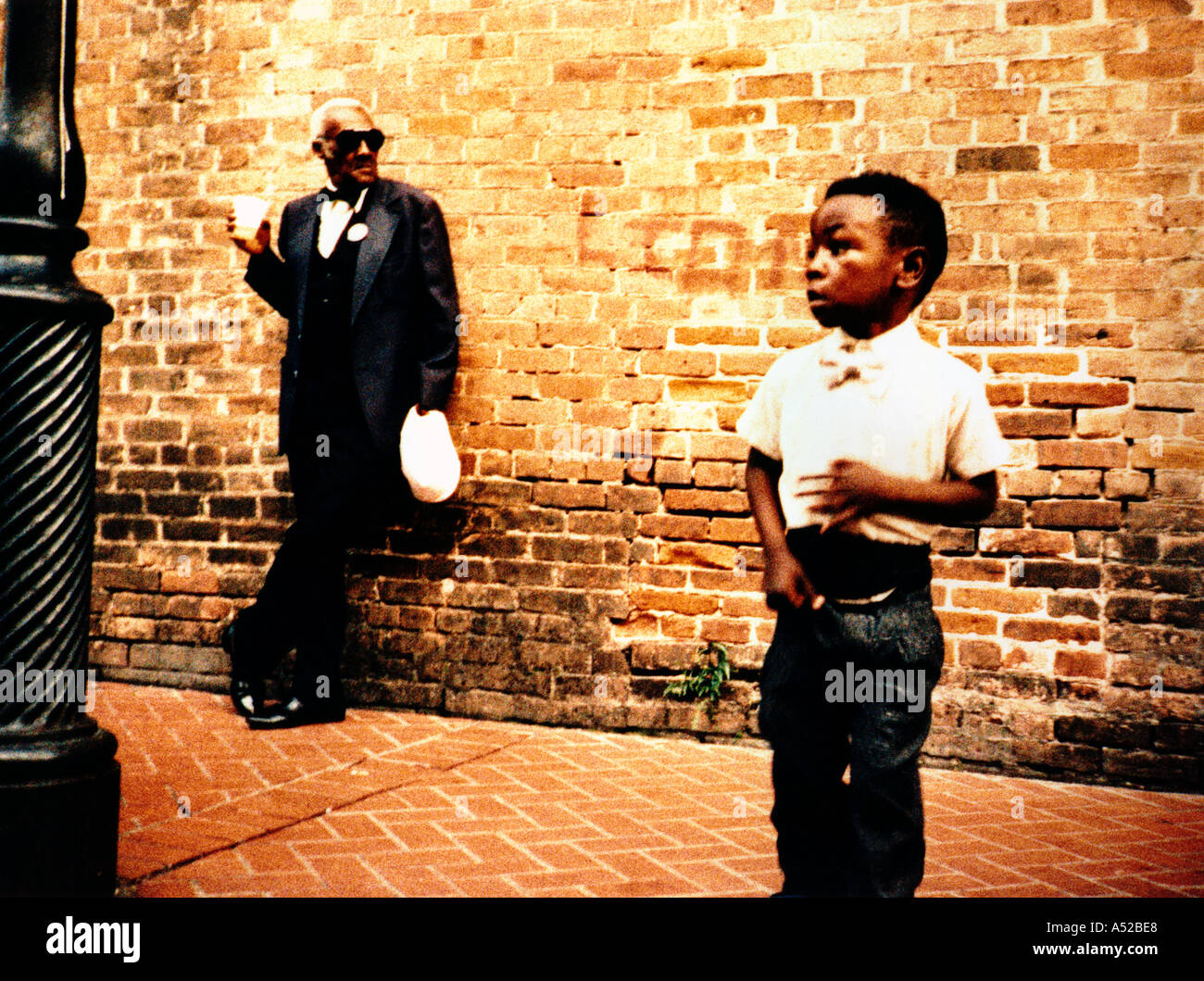Boy and a man in the streets of New Orleans Stock Photo - Alamy
