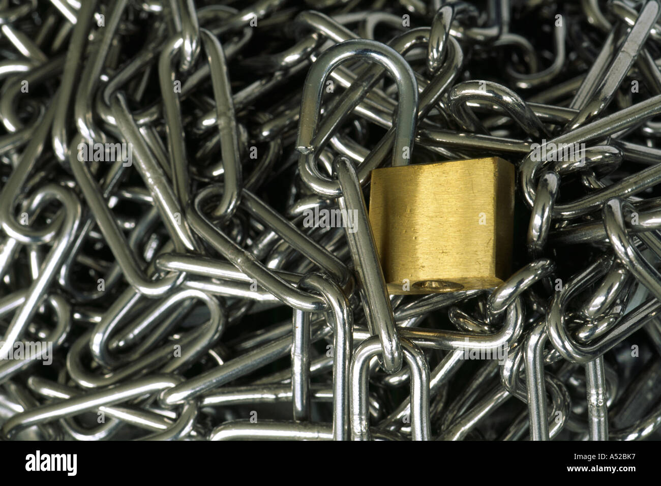 Stainless steel closed link chain with open brass padlock Stock Photo ...