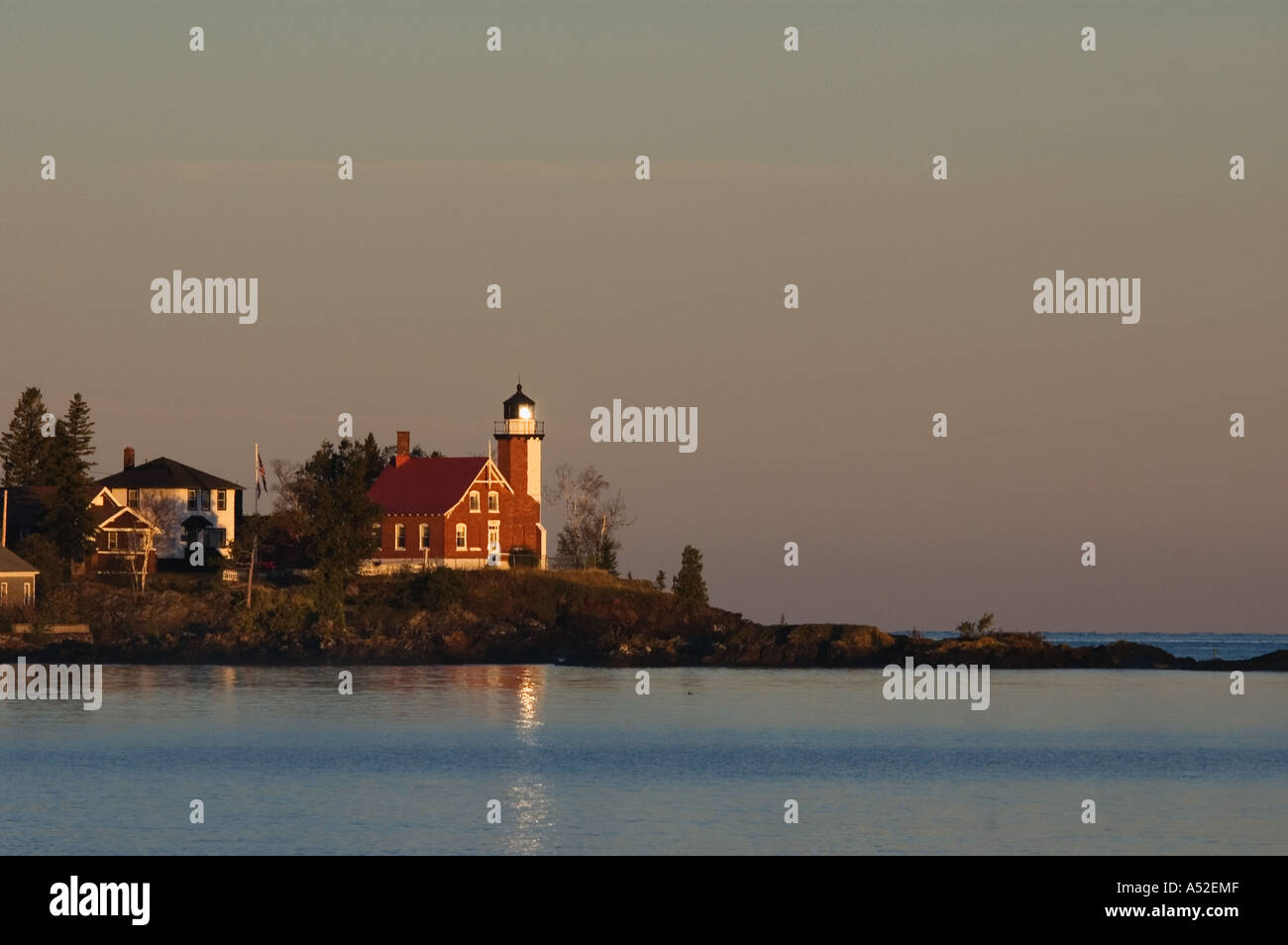 First Light of Day Illuminating Eagle Harbor Lighthouse on Lake ...